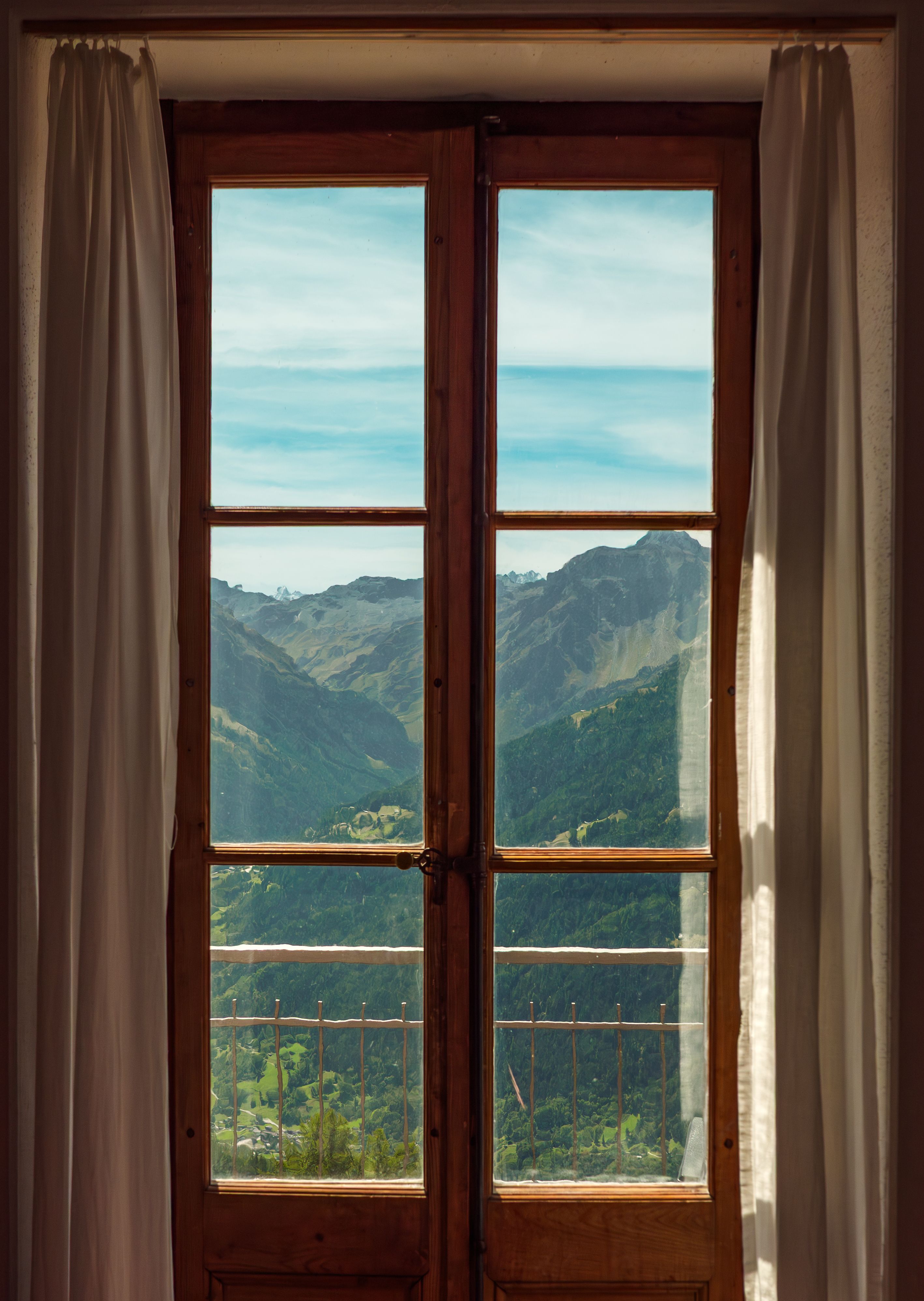 Scenic Mountain View Through Wooden French Doors · Free Stock Photo