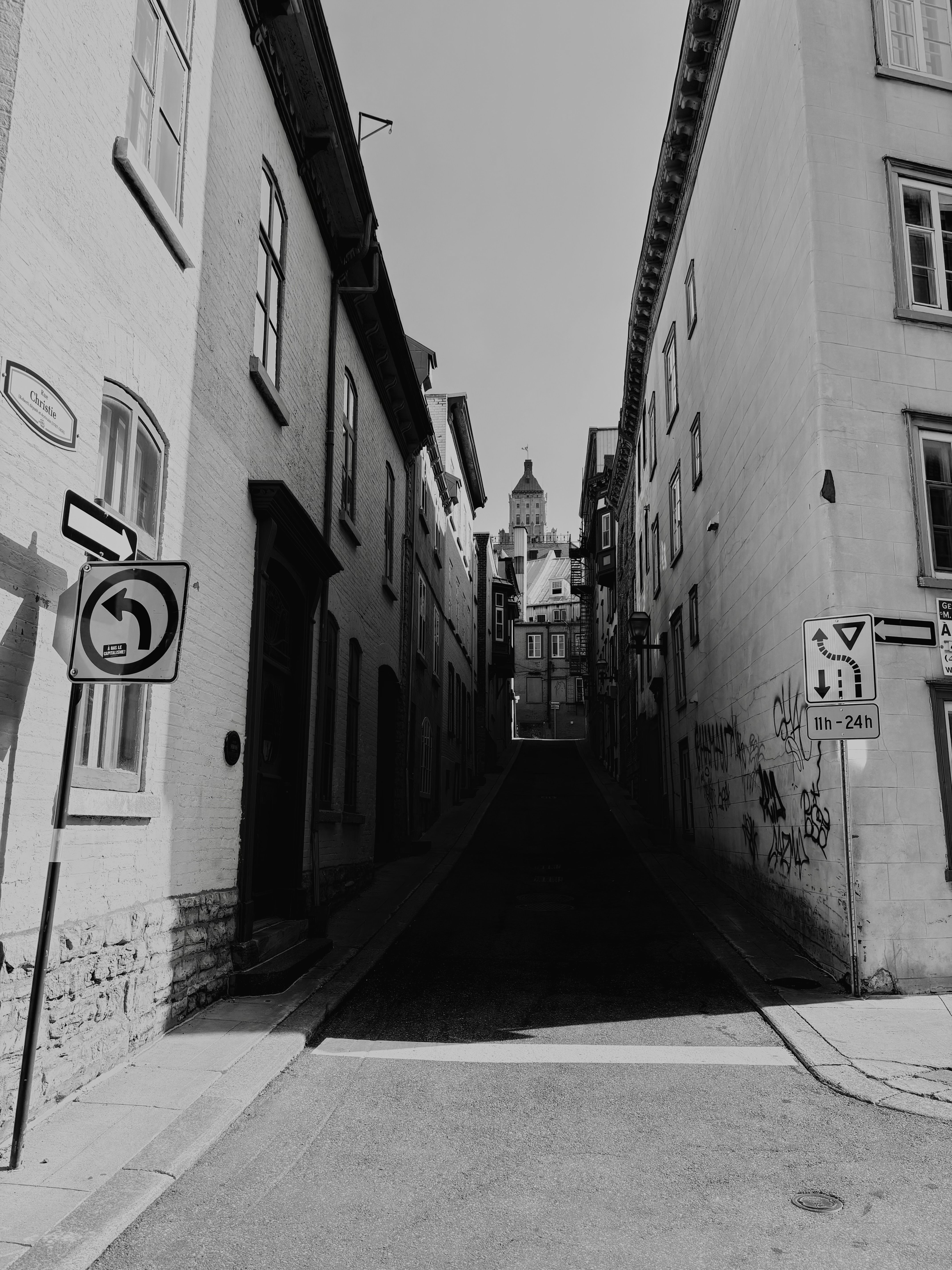 Black and White Urban Alleyway with Old Architecture · Free Stock Photo