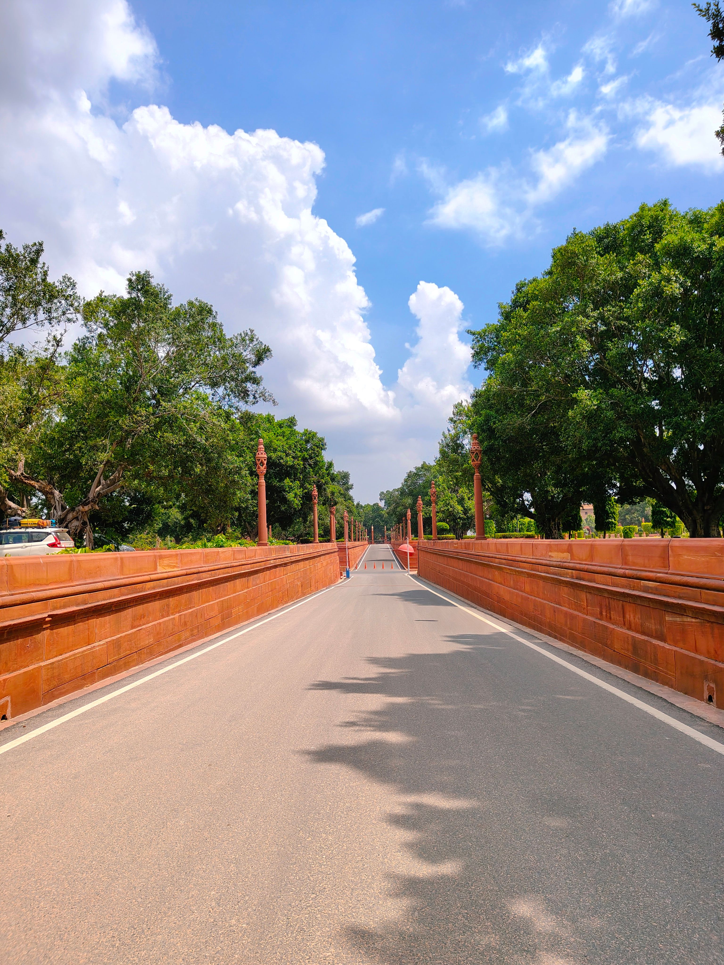 Picturesque Red Stone Bridge in Lush Surroundings · Free Stock Photo