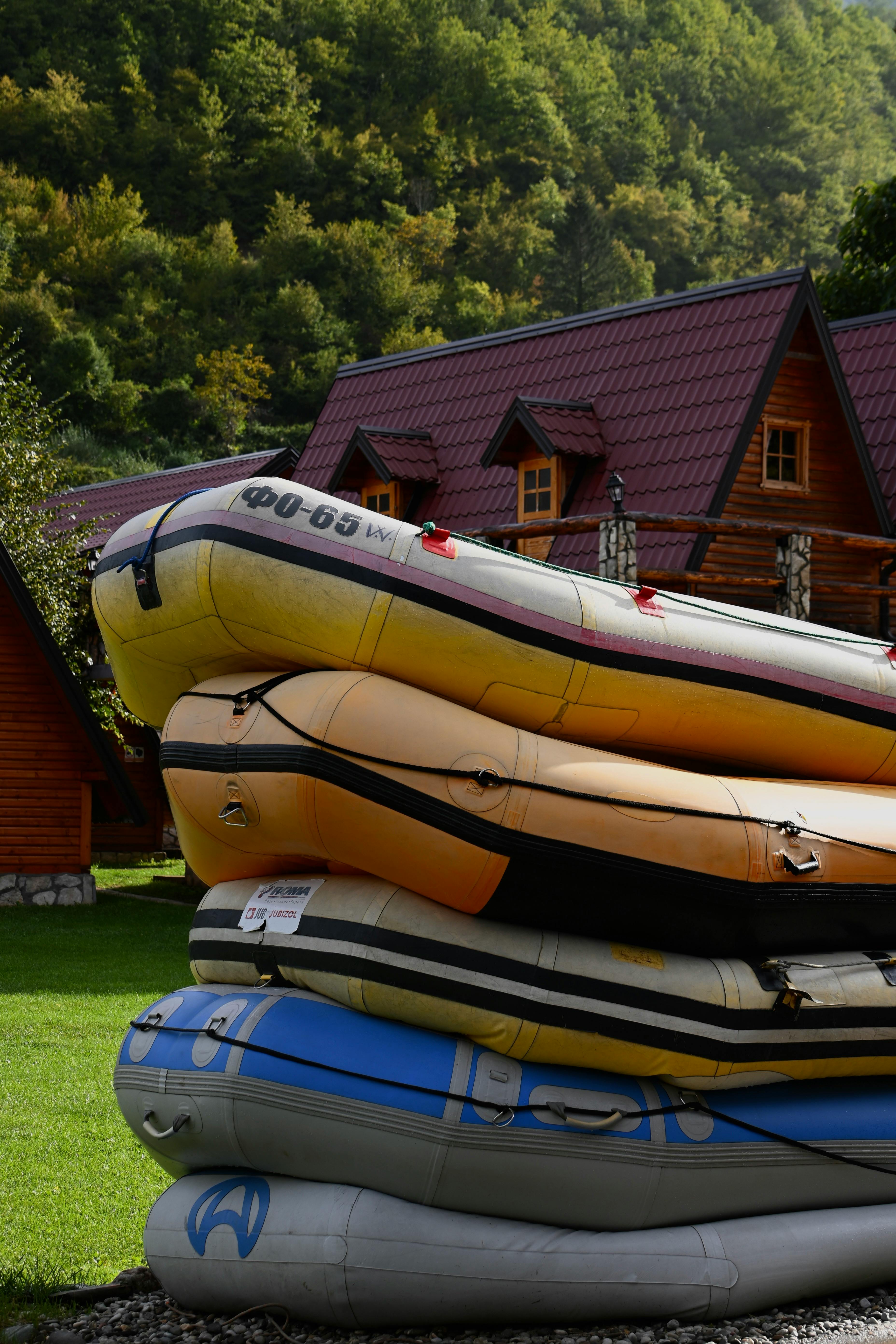 Stack of Inflatable Rafts by Cozy Cabins · Free Stock Photo