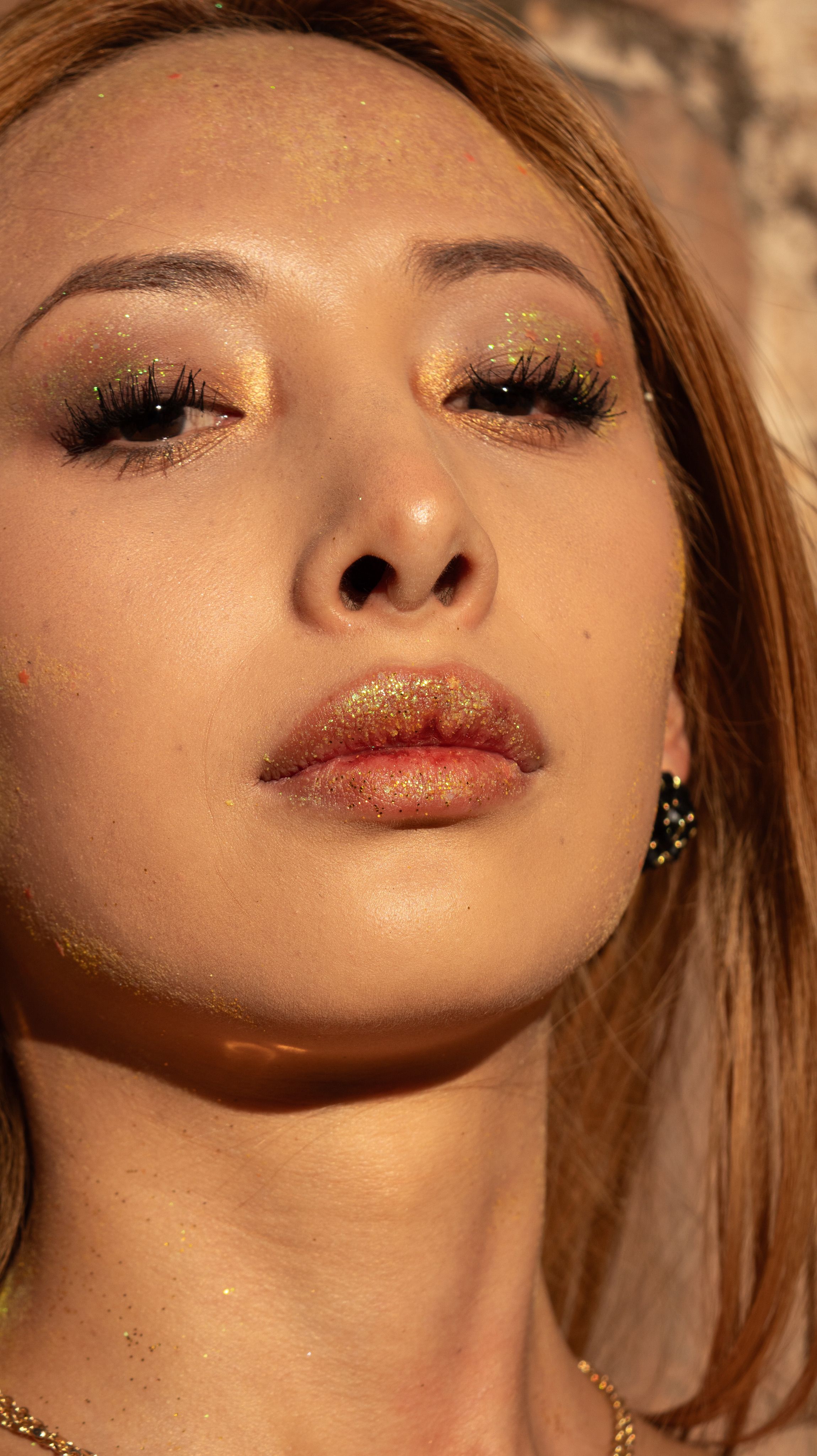 Close-up of Woman with Glitter Makeup in Sunlight · Free Stock Photo