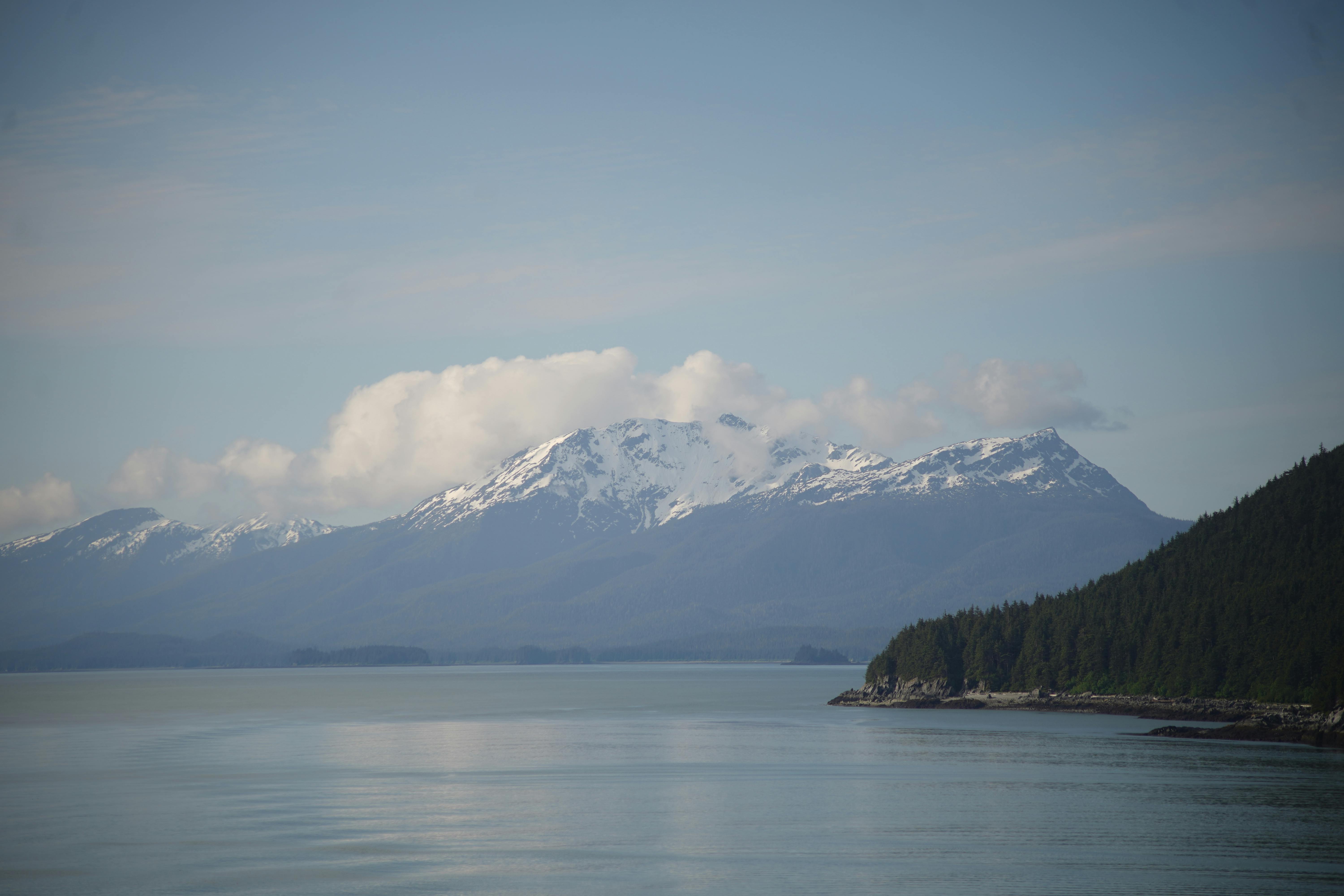 Mountain With Snow Cap Under Cloudy Sky at Daytime · Free Stock Photo