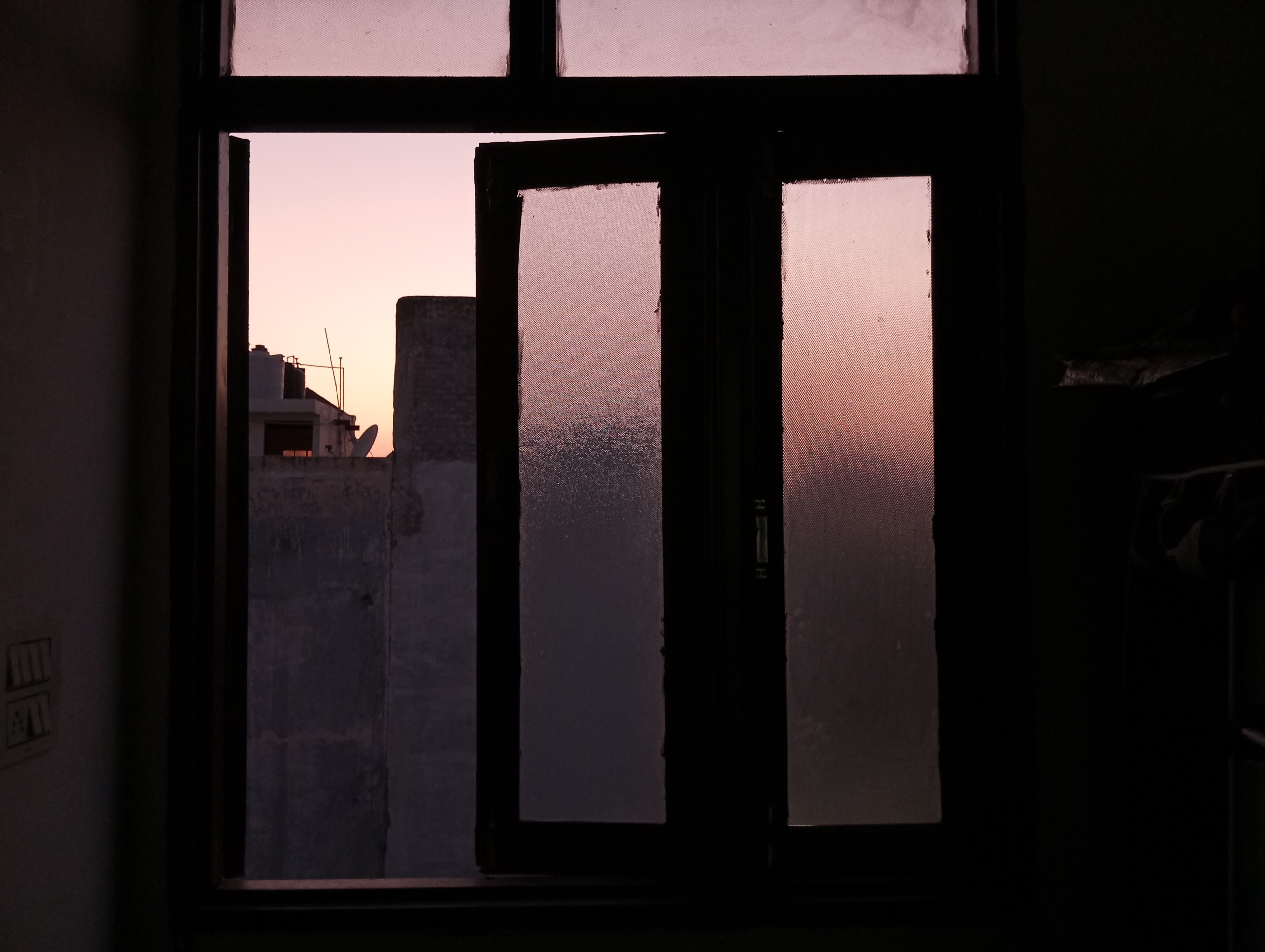 Sunset View Through Frosted Glass Window in Delhi · Free Stock Photo