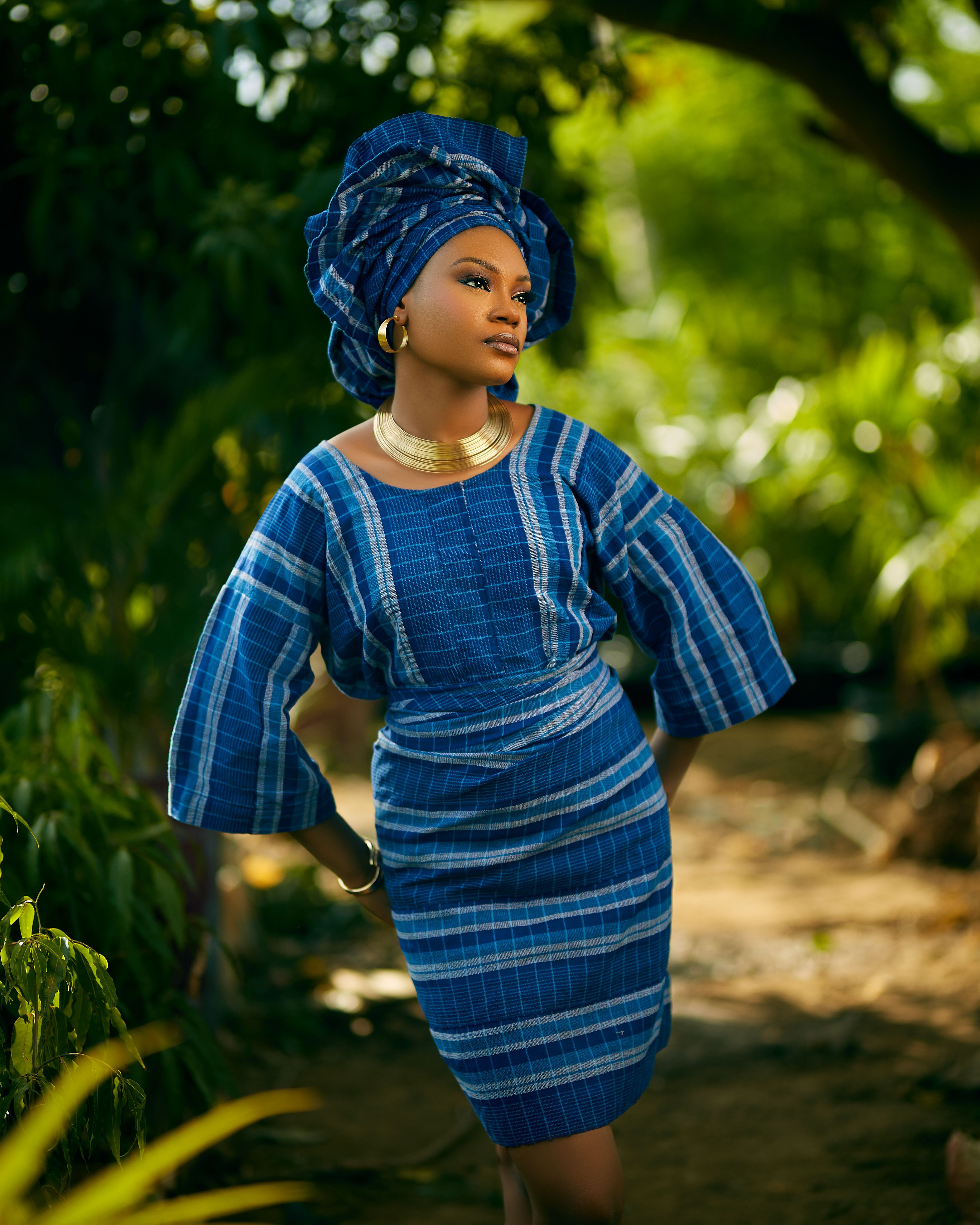 Elegant Woman in Traditional Blue Attire Outdoors · Free Stock Photo