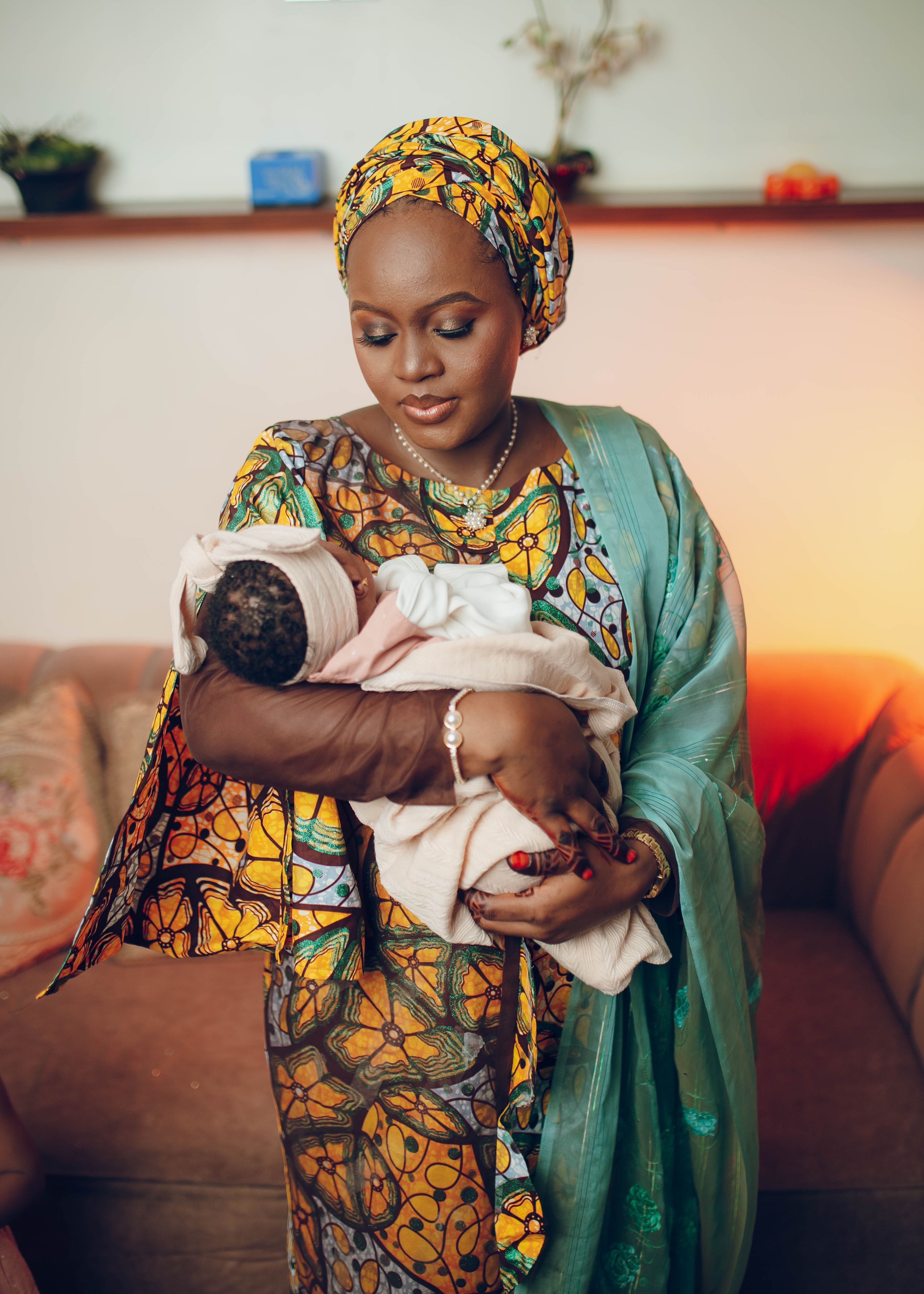 Nigerian Mother in Traditional Attire with Baby · Free Stock Photo