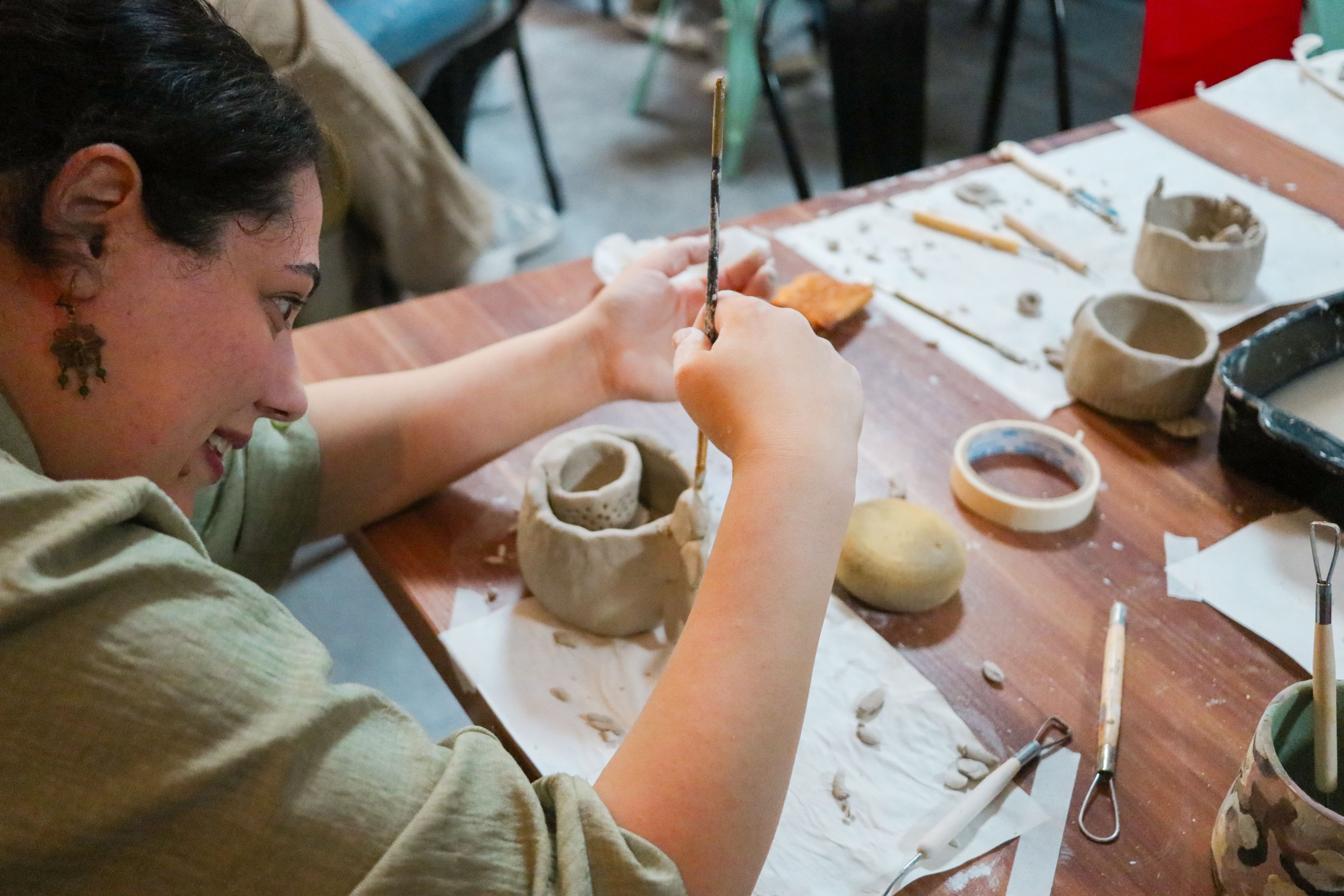 Woman Engaged in Creative Pottery Workshop Indoors · Free Stock Photo
