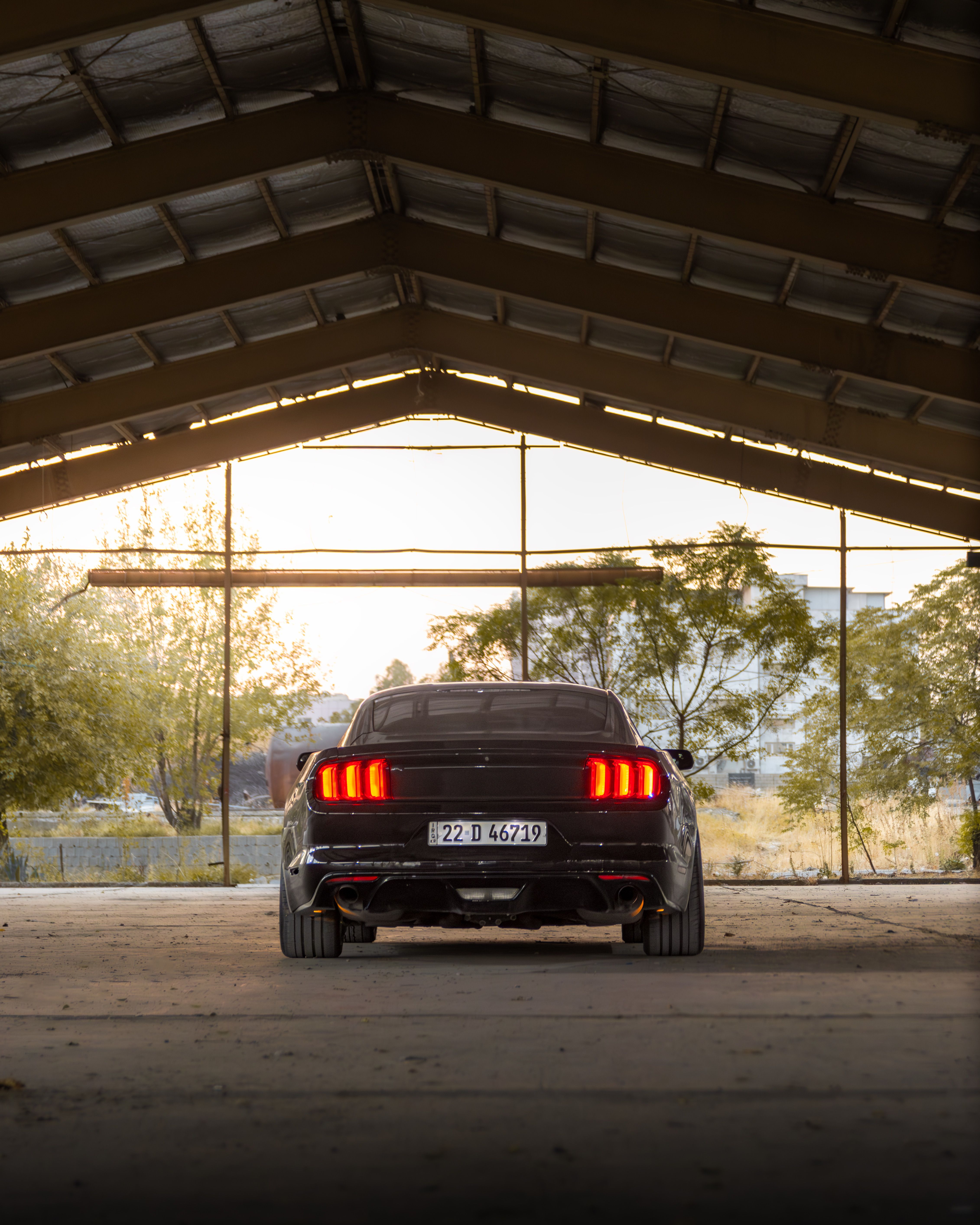 Rear View of a Car in Industrial Setting · Free Stock Photo
