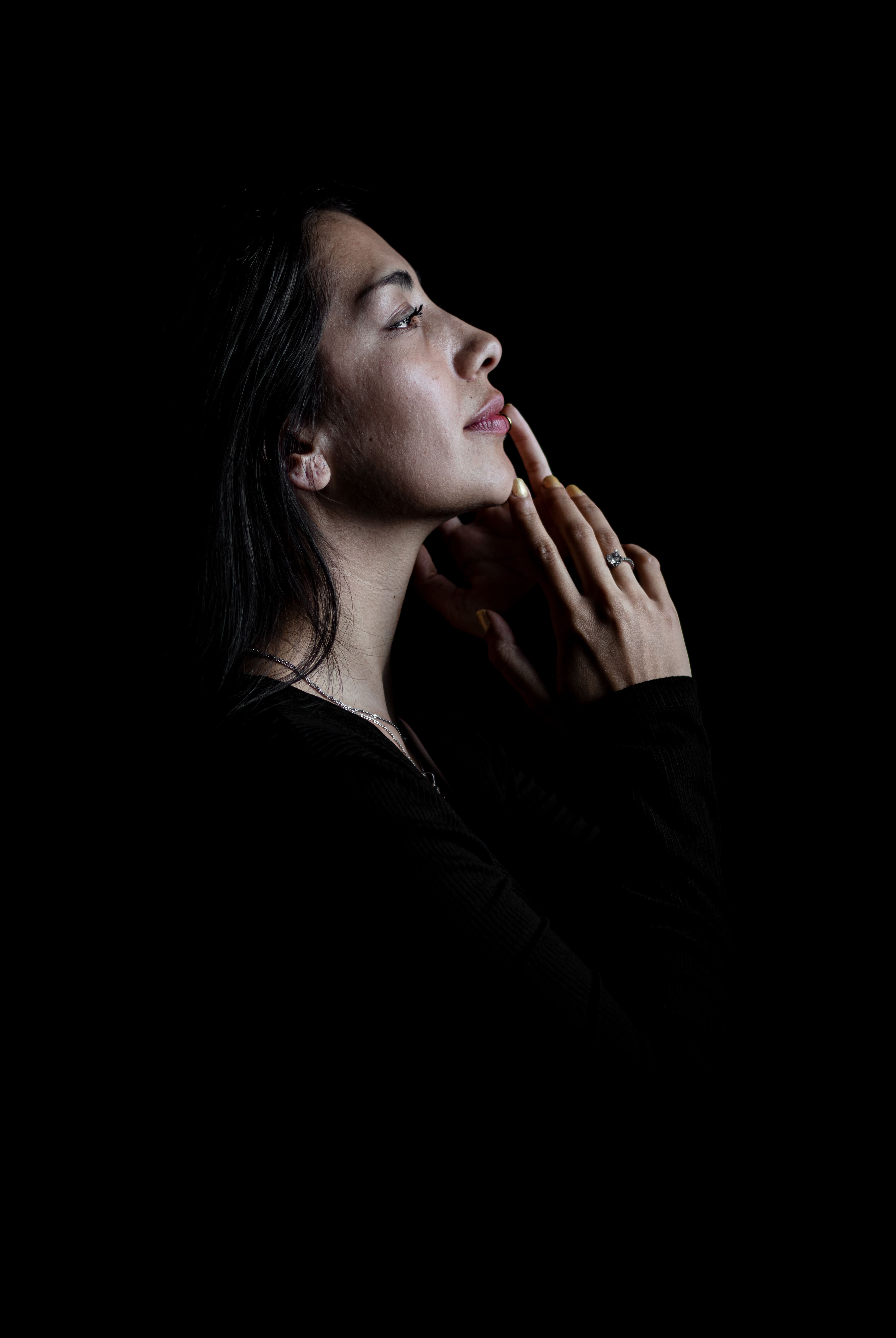 Elegant Side View Portrait with Dramatic Lighting · Free Stock Photo