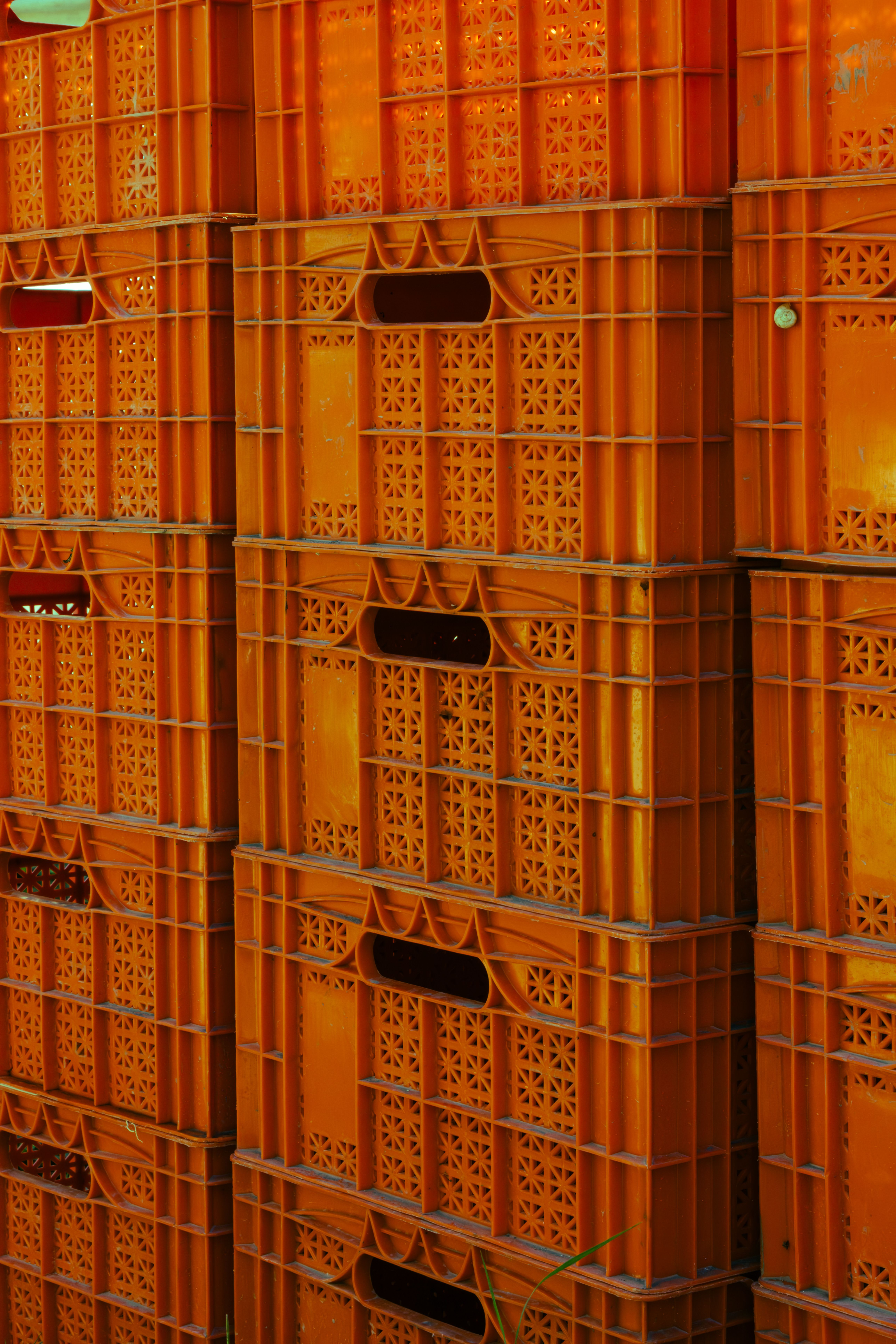 Stacked Orange Plastic Crates in Warehouse · Free Stock Photo