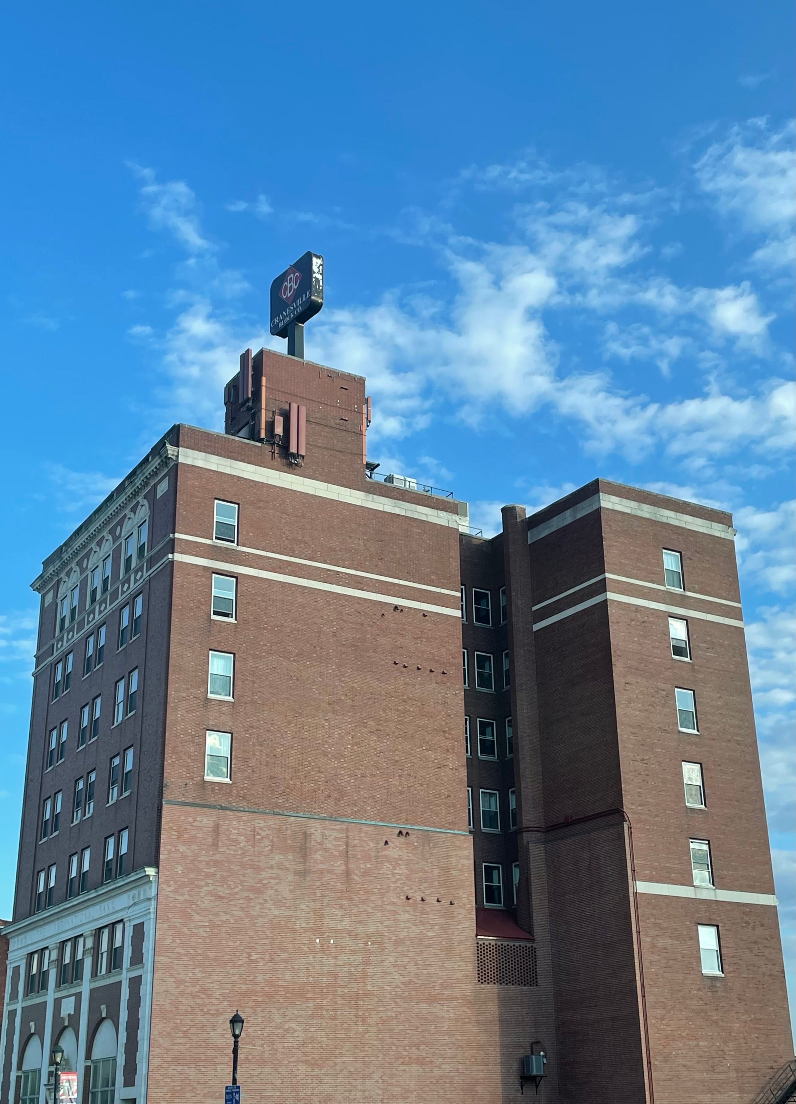 Historic Red Brick Building Against Blue Sky · Free Stock Photo