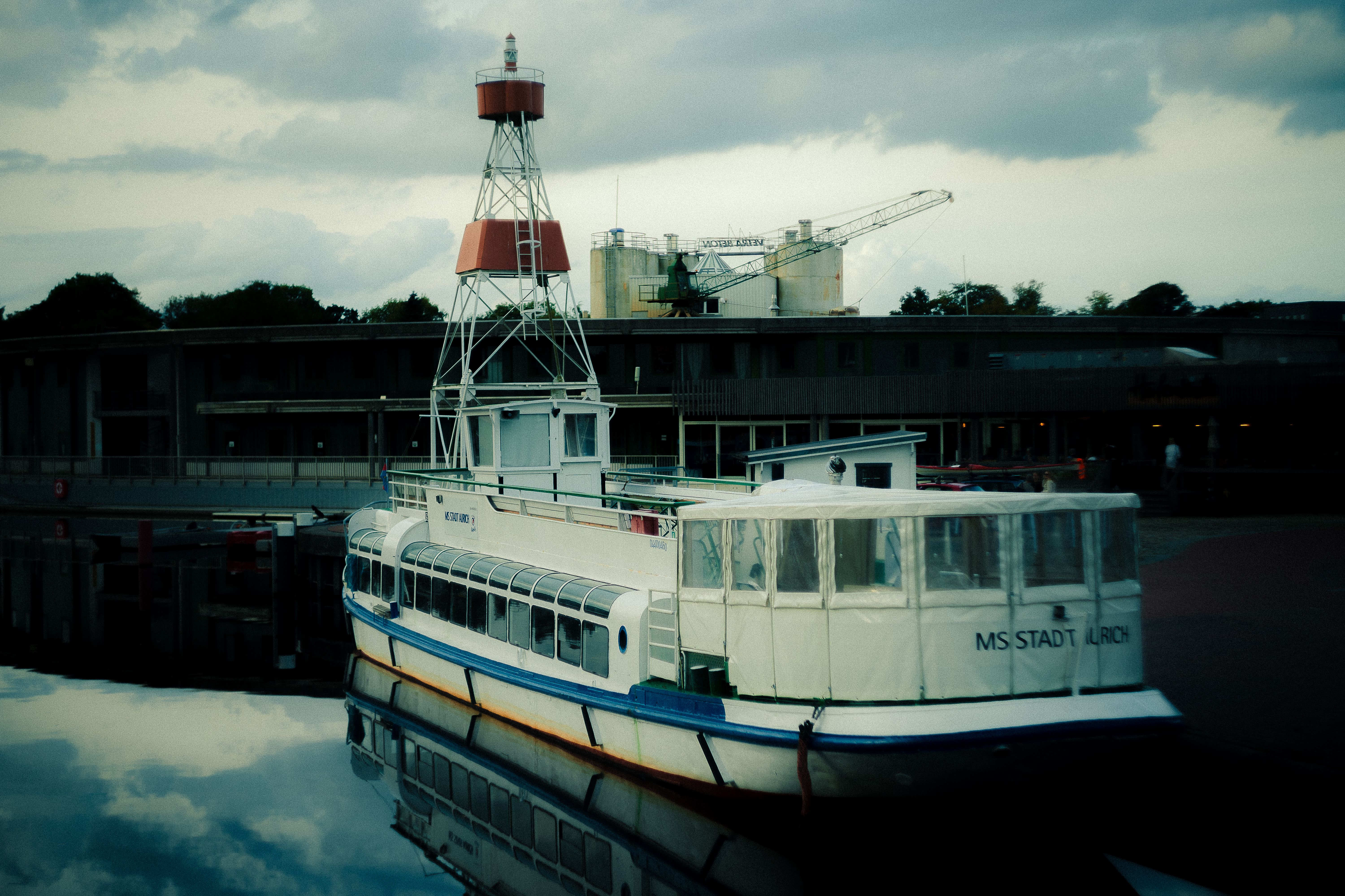 Boat Docked in Aurich Harbor, Lower Saxony · Free Stock Photo