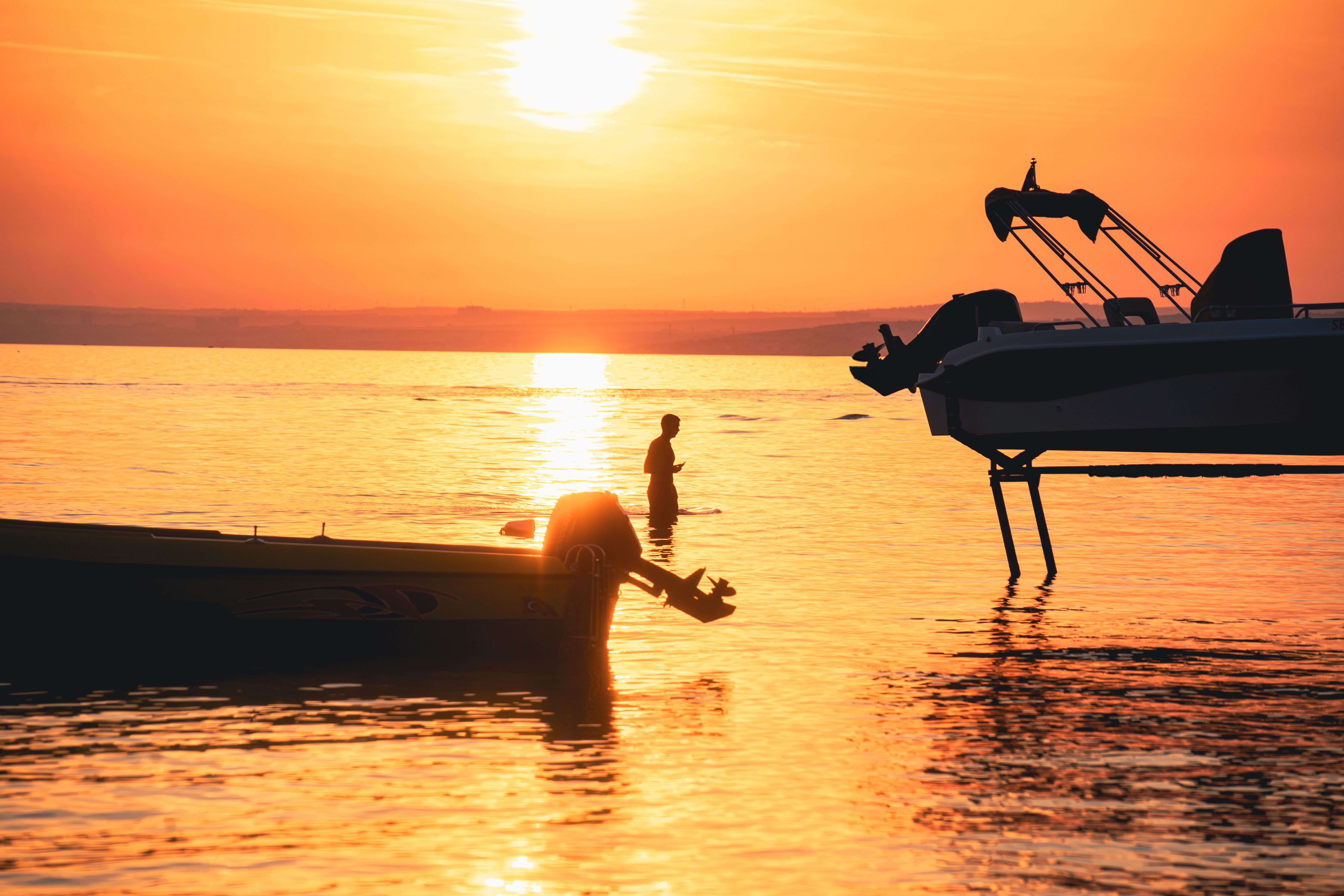 Motor Boat Near Dock during Sunset · Free Stock Photo
