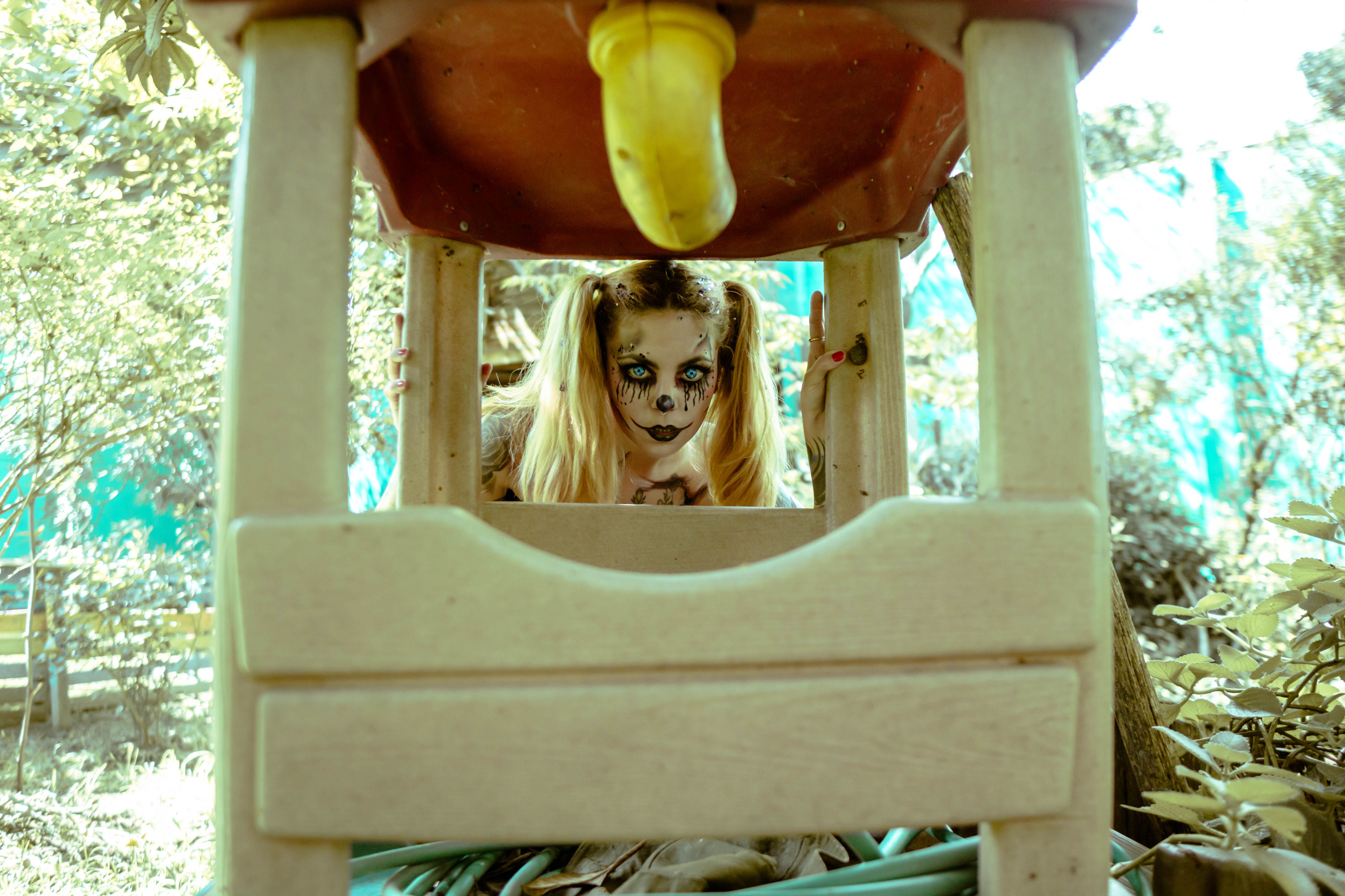 Creepy Clown Staring Outside a Playhouse · Free Stock Photo