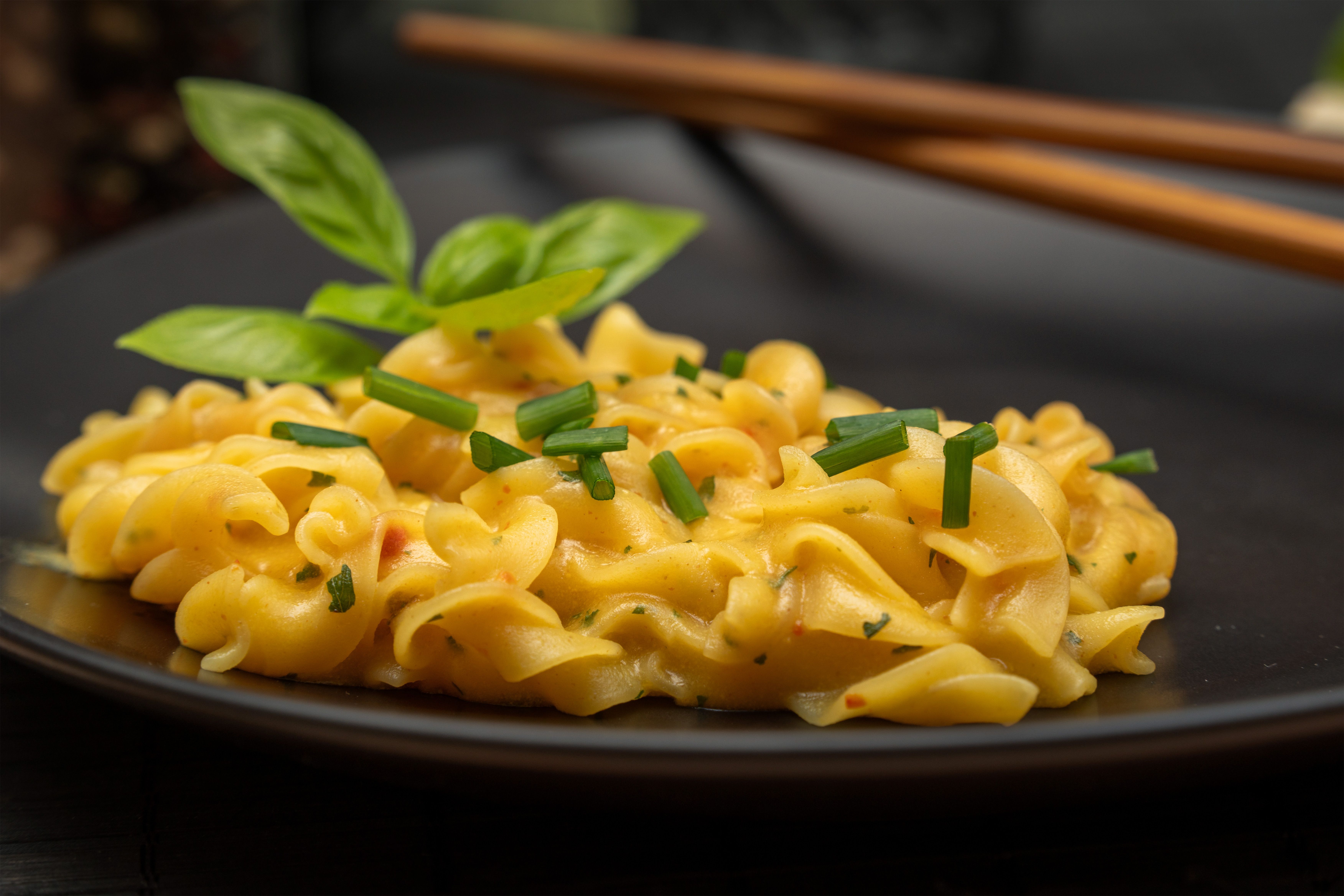 Delicious Creamy Pasta with Fresh Basil Topping · Free Stock Photo