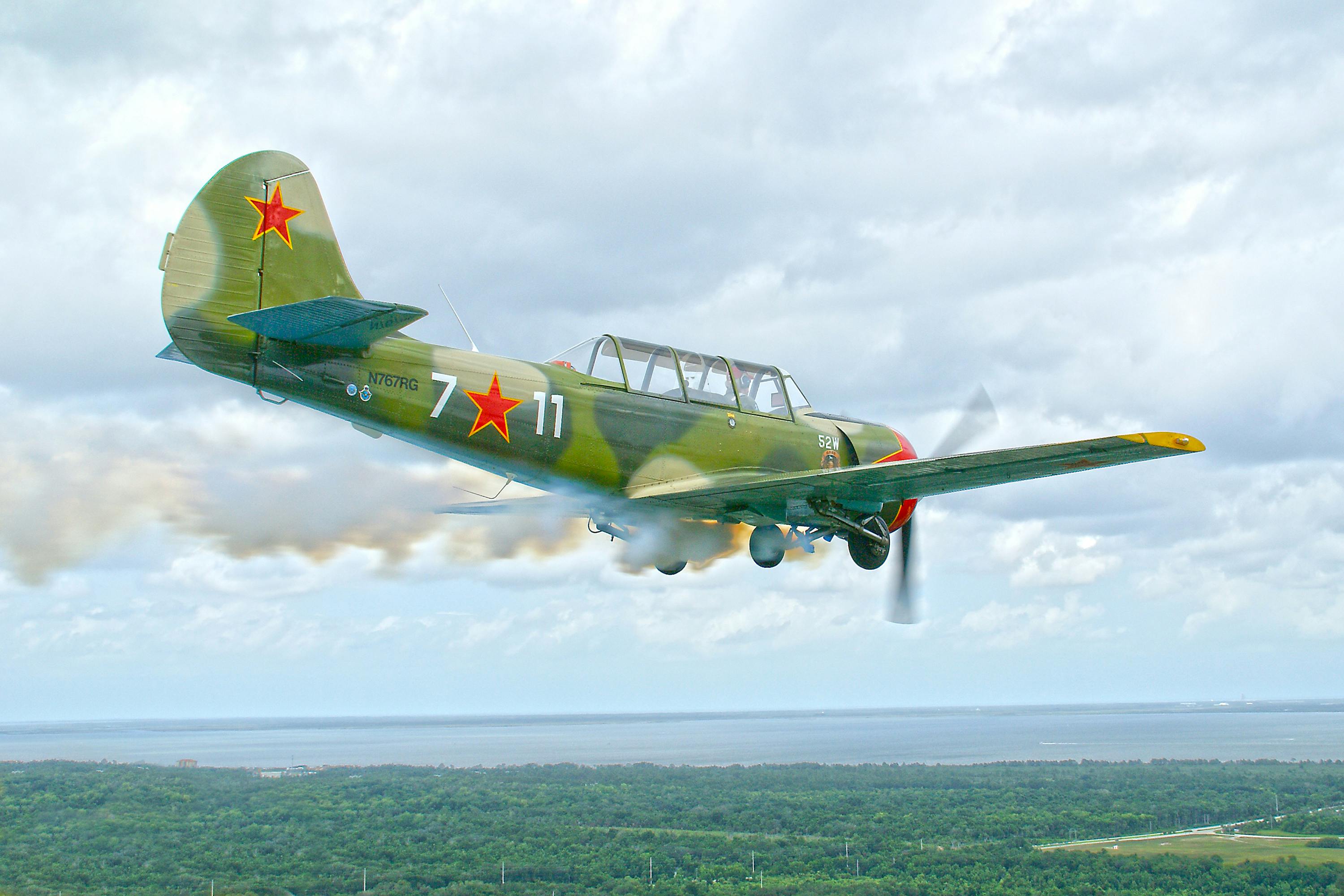 Soviet Yak-52 Training Aircraft Flying High · Free Stock Photo