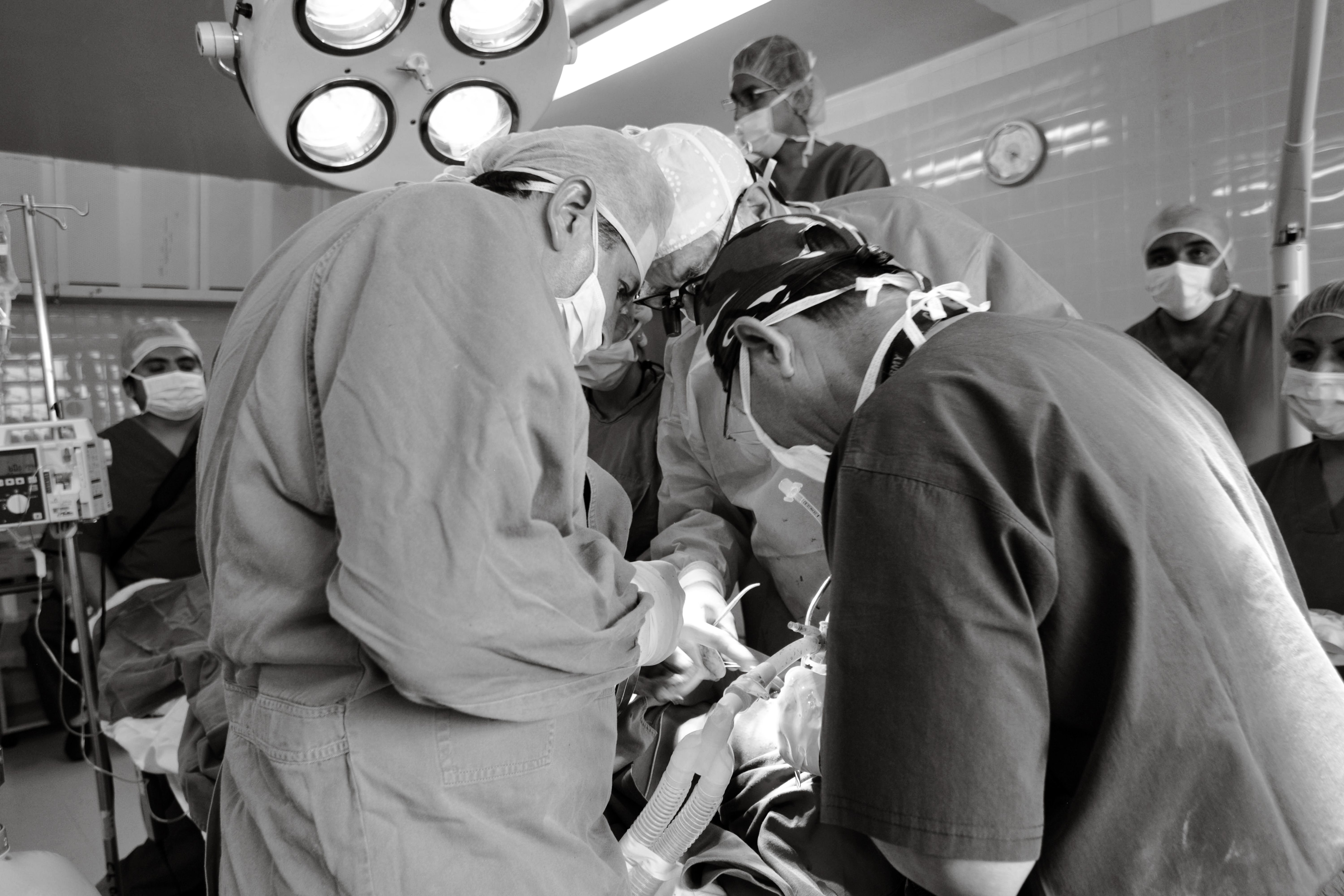 Medical Team Performing Surgery in Operating Room · Free Stock Photo