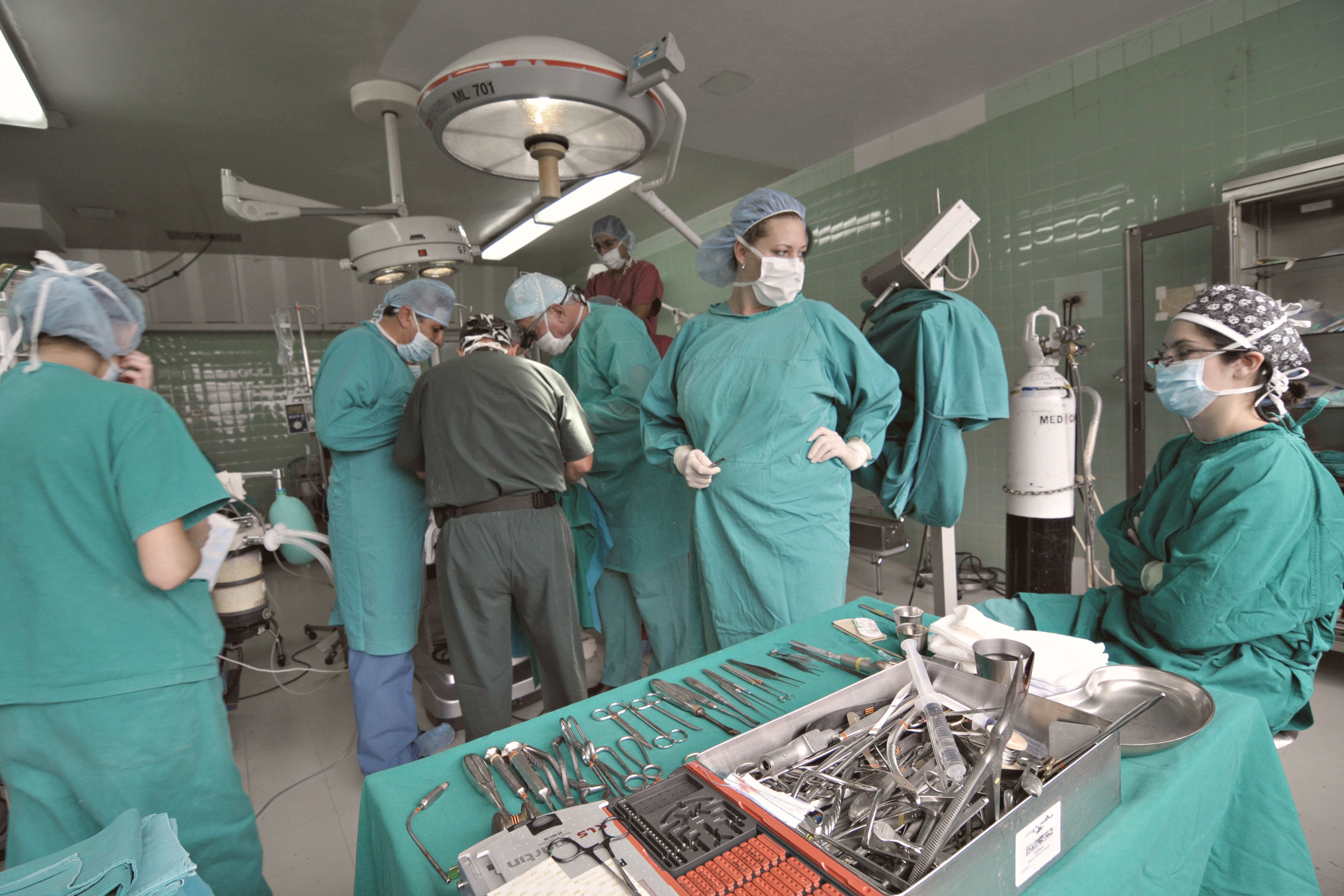Medical Team Performing Surgery in Operating Room · Free Stock Photo