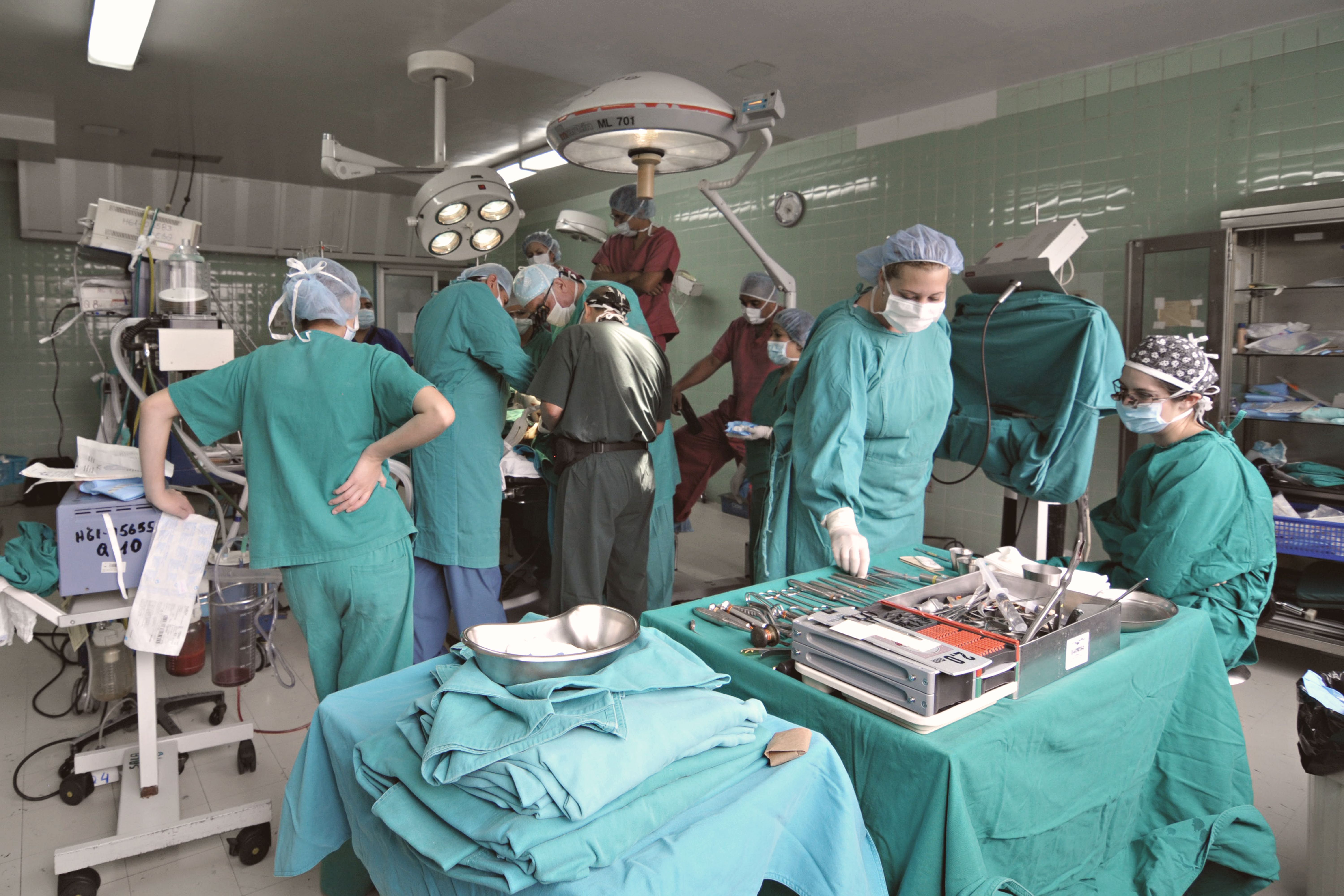 Busy Surgical Team Operating in Hospital Room · Free Stock Photo