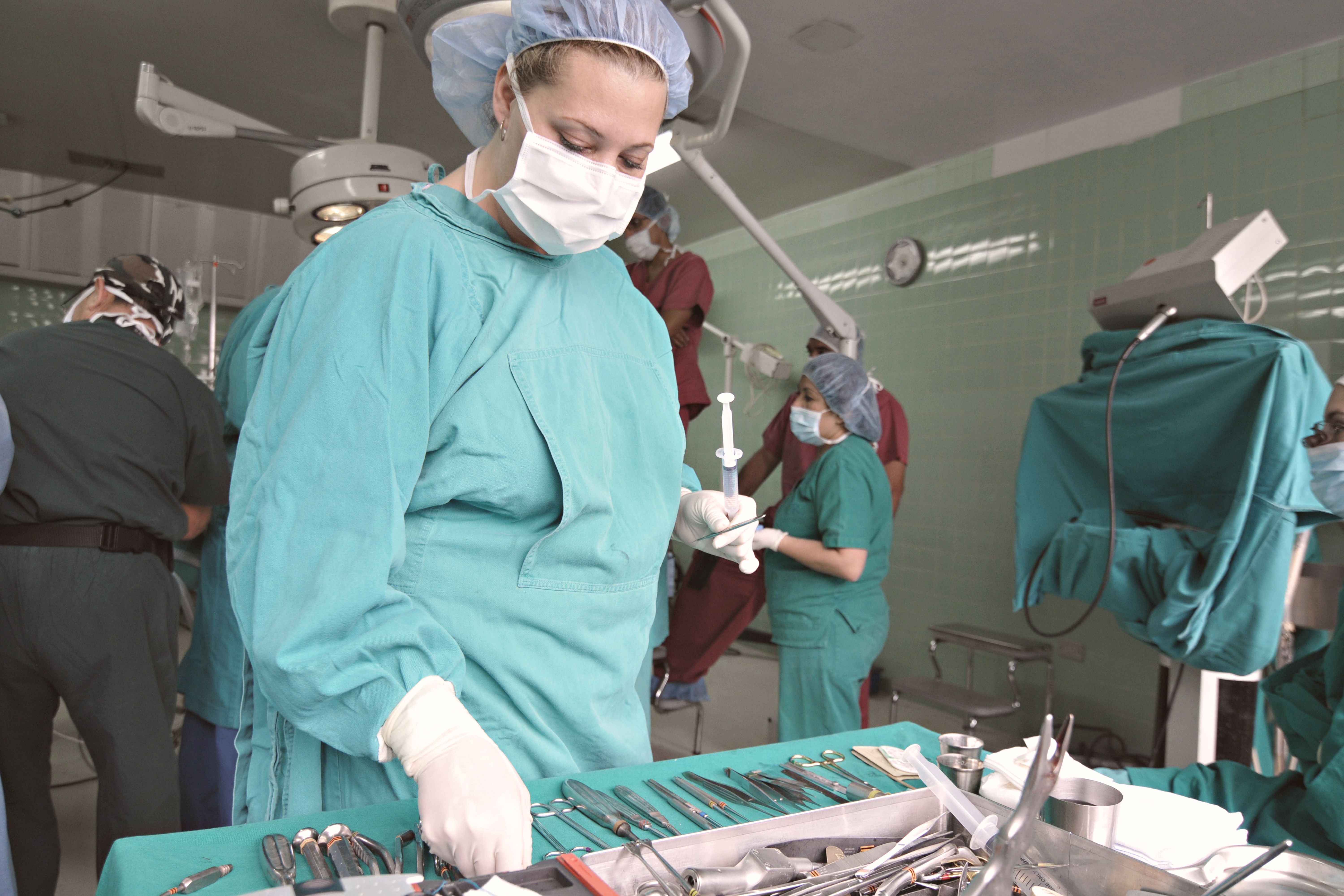 Medical Team in Operating Room Performing Surgery · Free Stock Photo