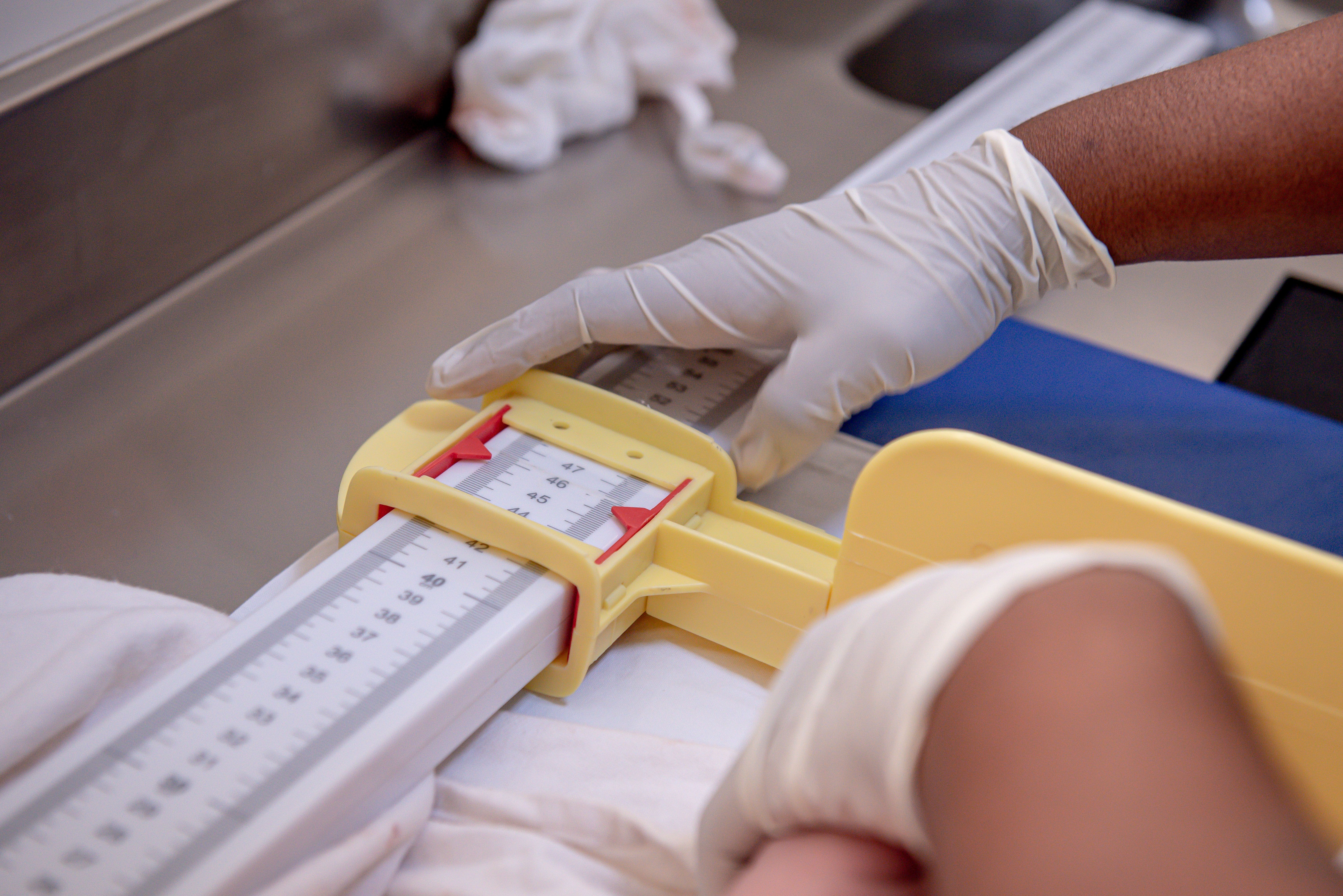 Measuring Infant with Medical Ruler Tool · Free Stock Photo