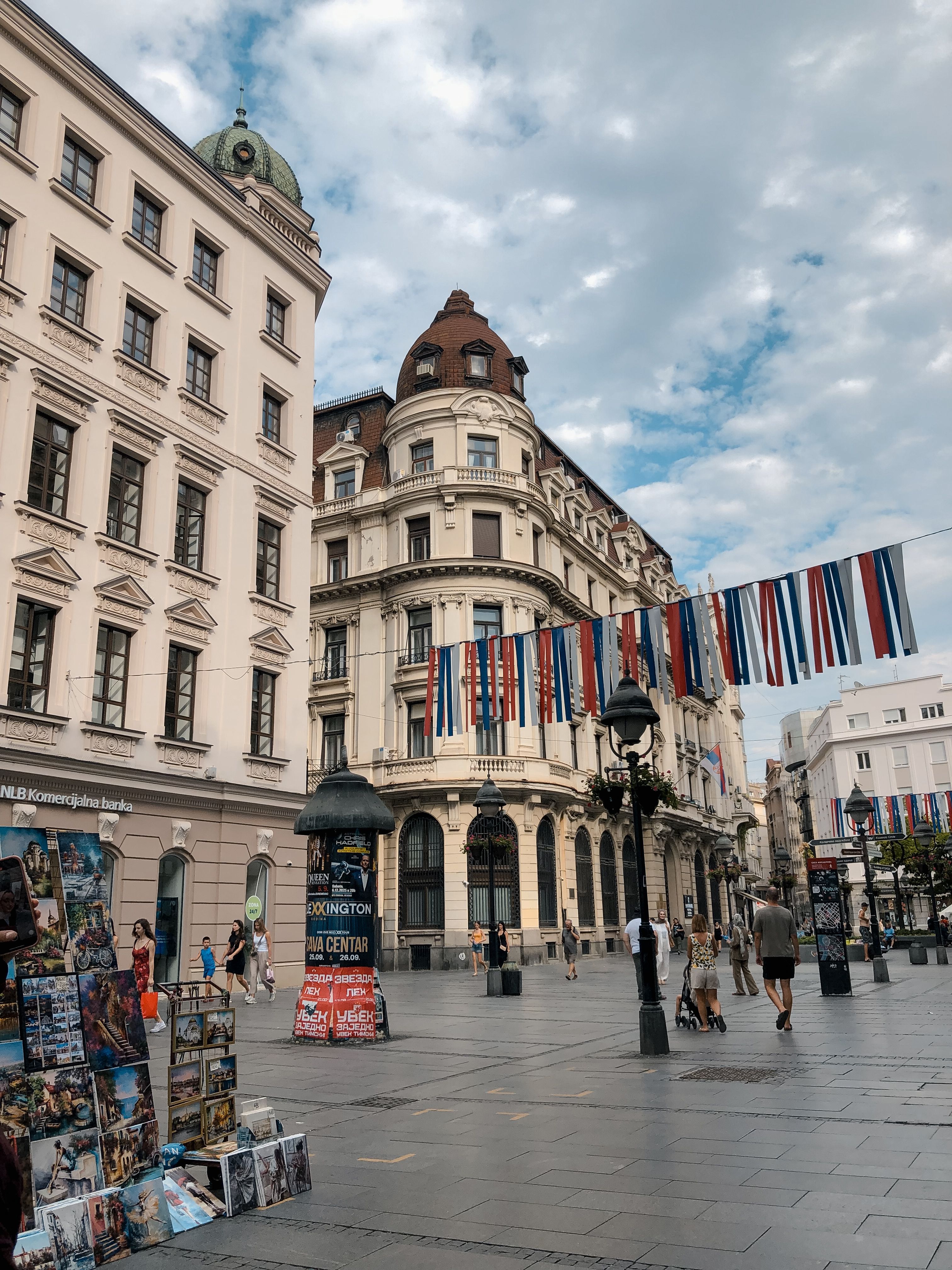 Lively European Street with Historic Architecture · Free Stock Photo