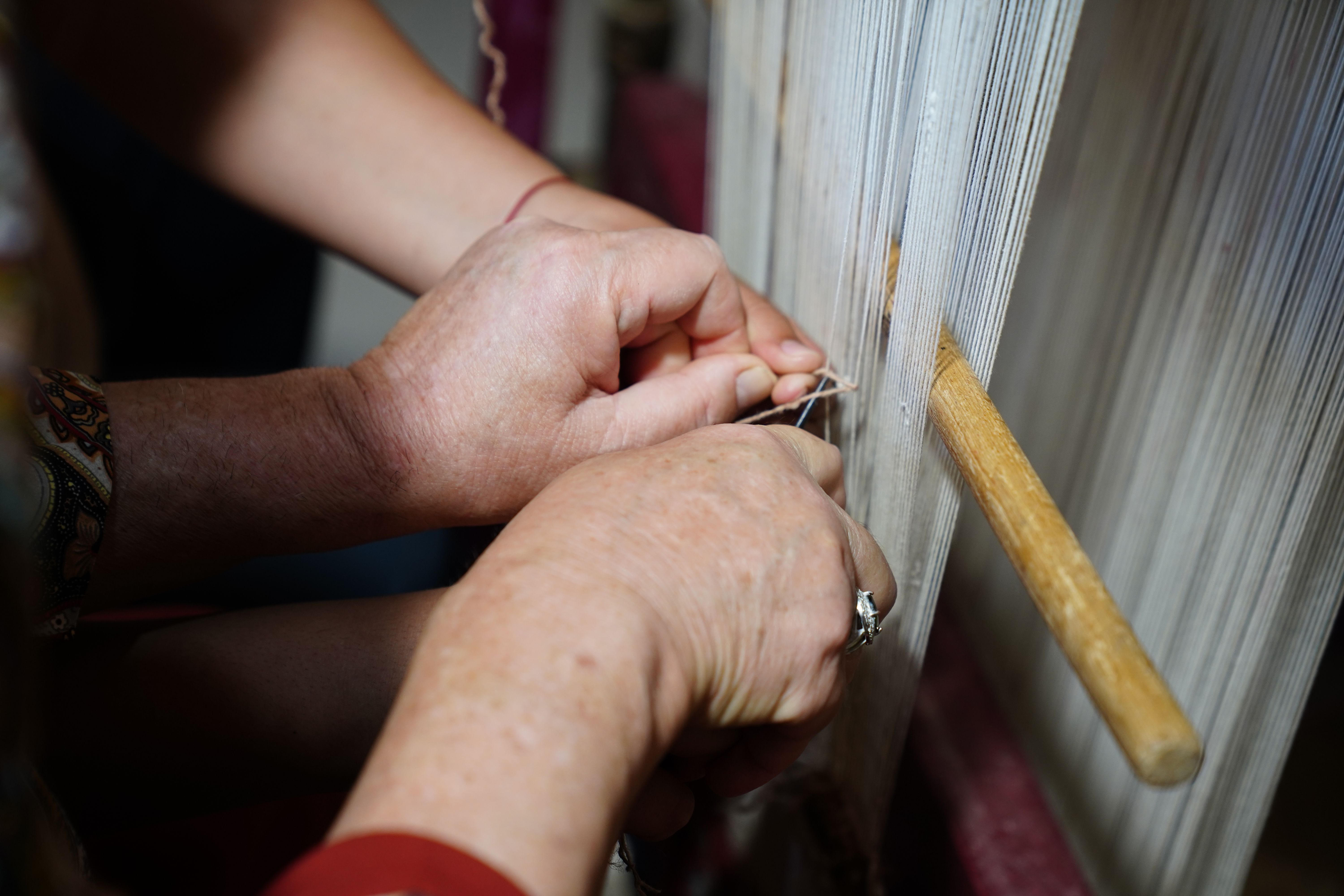 Close-up of Hands Weaving on a Loom · Free Stock Photo