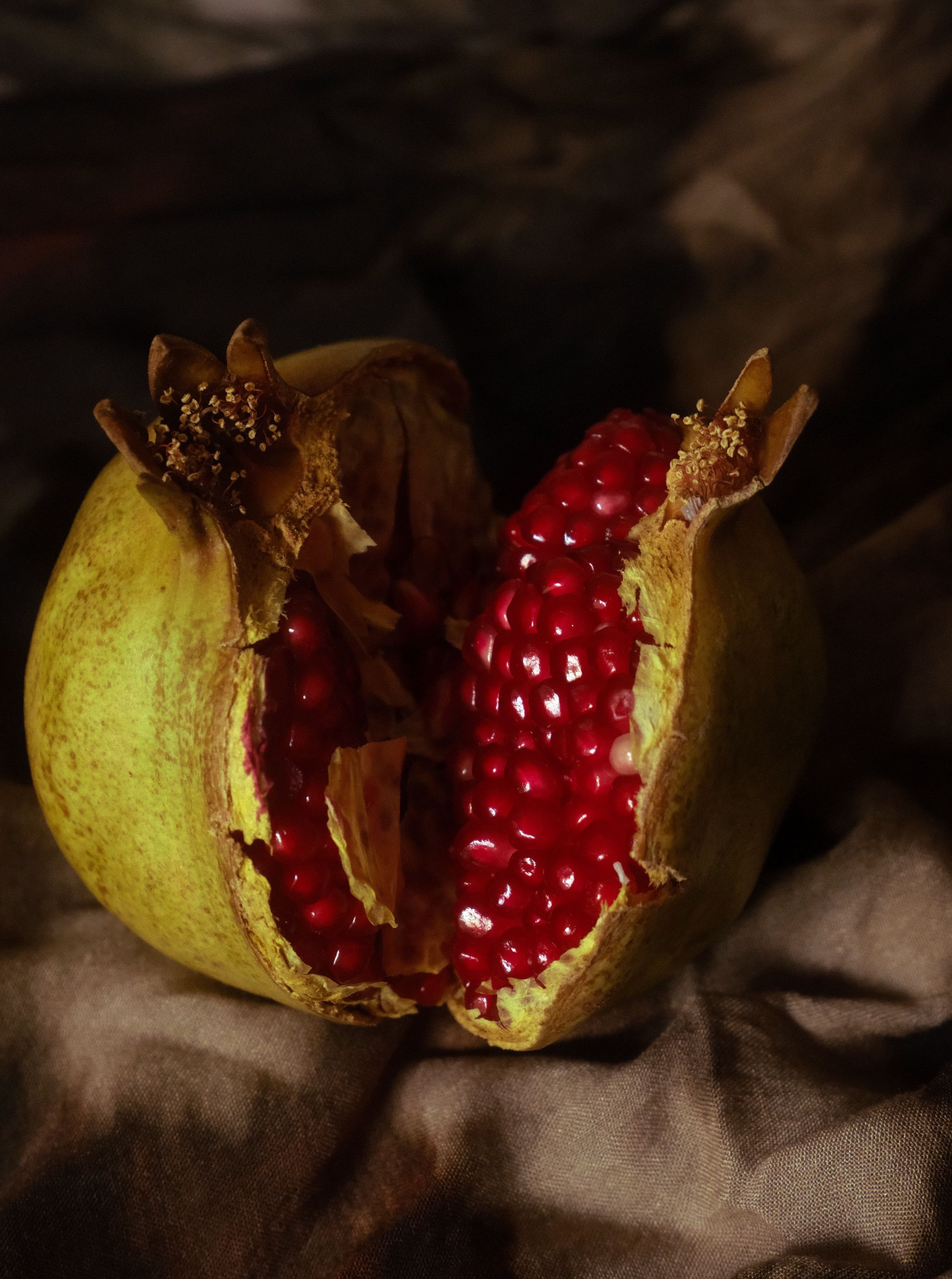 Close-up of a Ripe Pomegranate Split in Half · Free Stock Photo