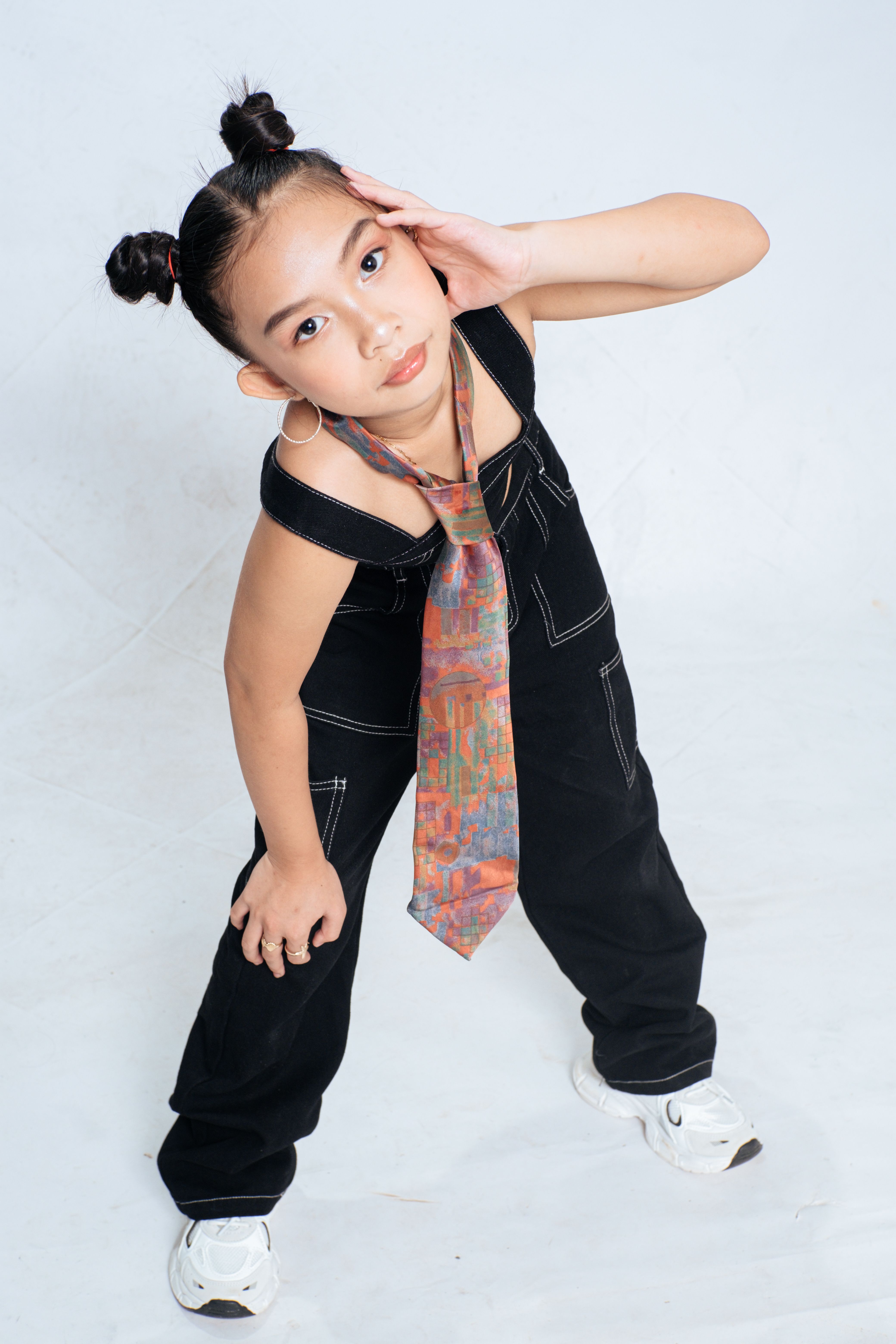 Stylish Young Girl in Unique Fashion Pose · Free Stock Photo