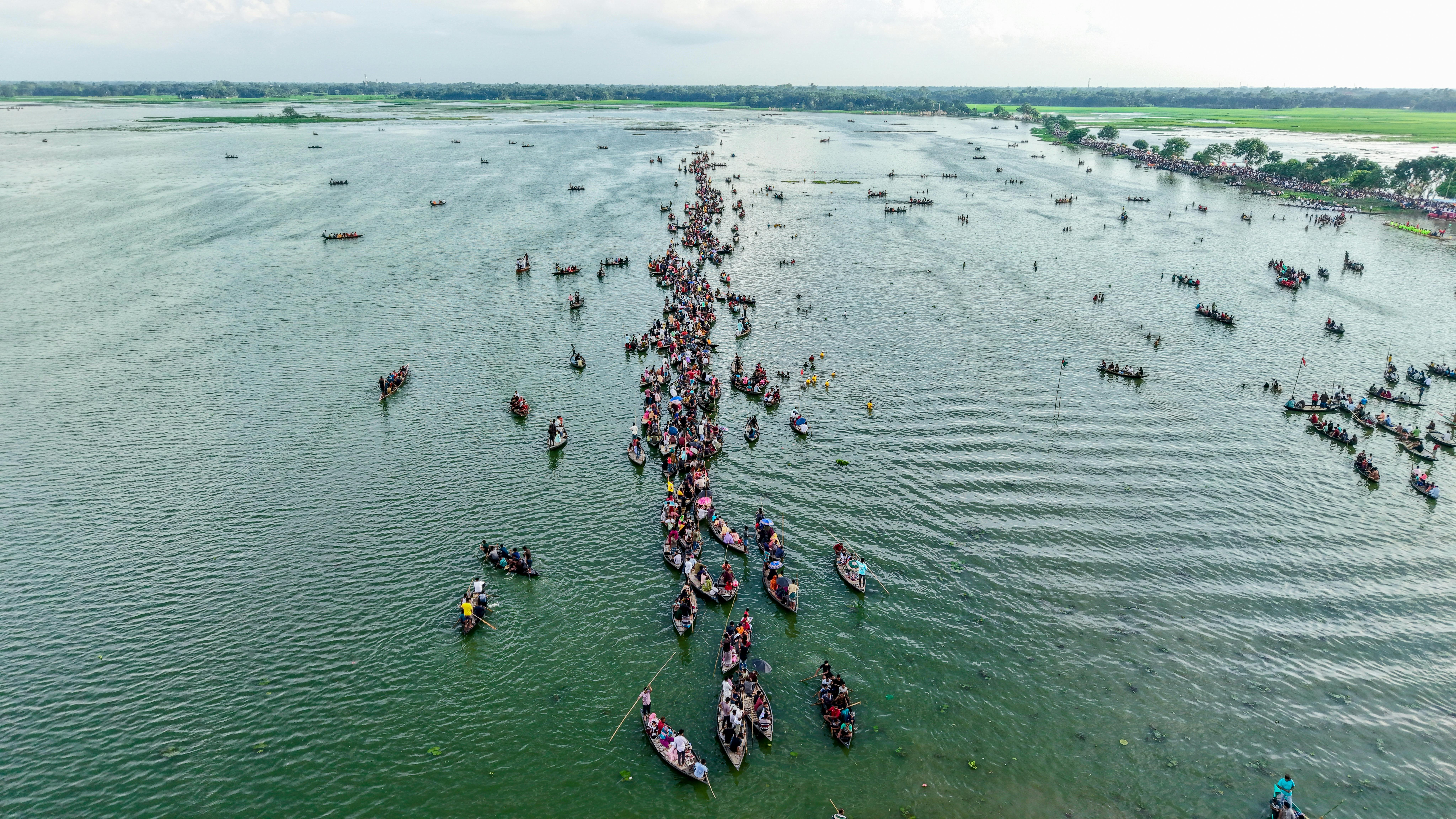 Aerial View of Vibrant Boat Gathering on The River · Free Stock Photo