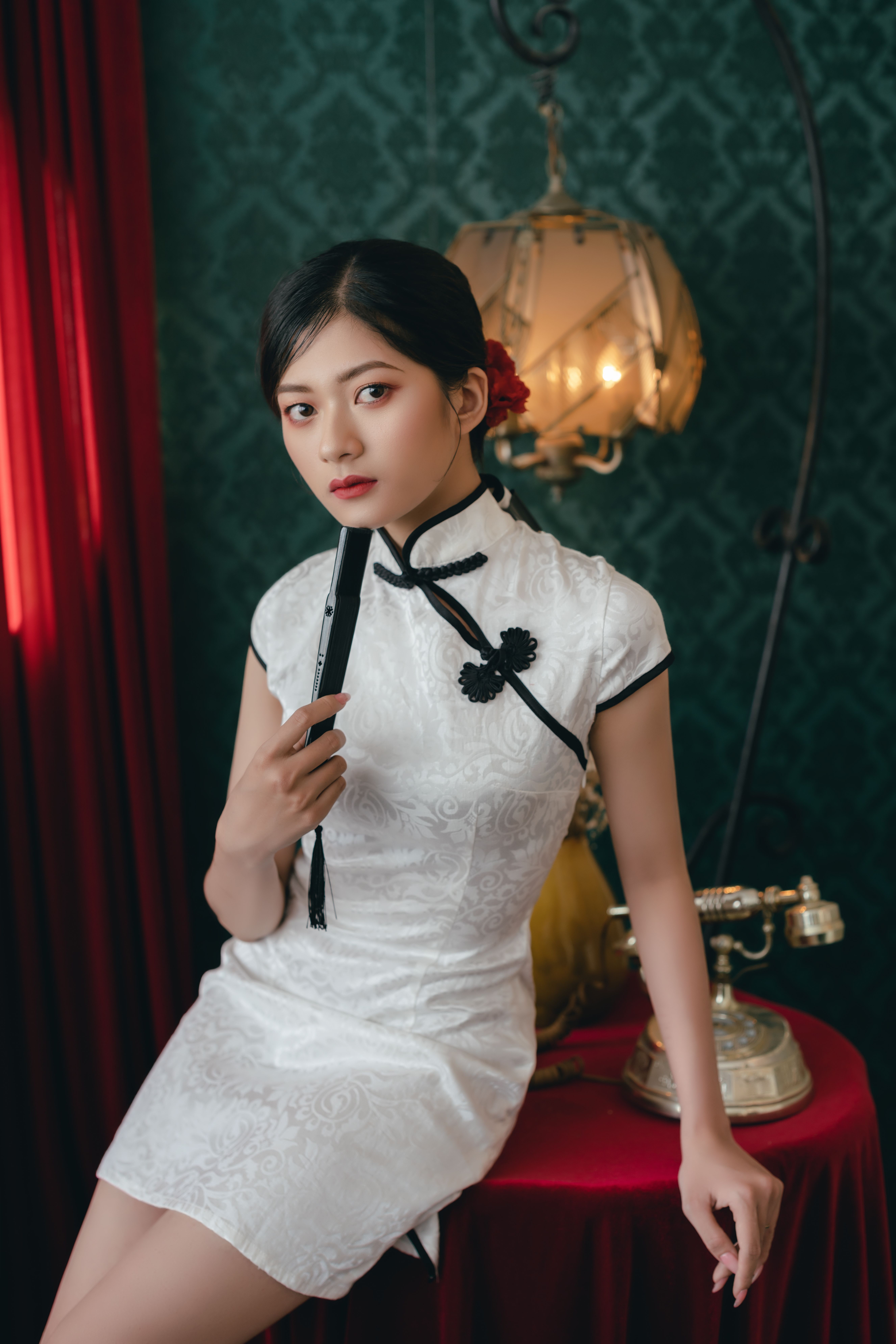 Elegant Woman in Traditional Cheongsam Dress · Free Stock Photo