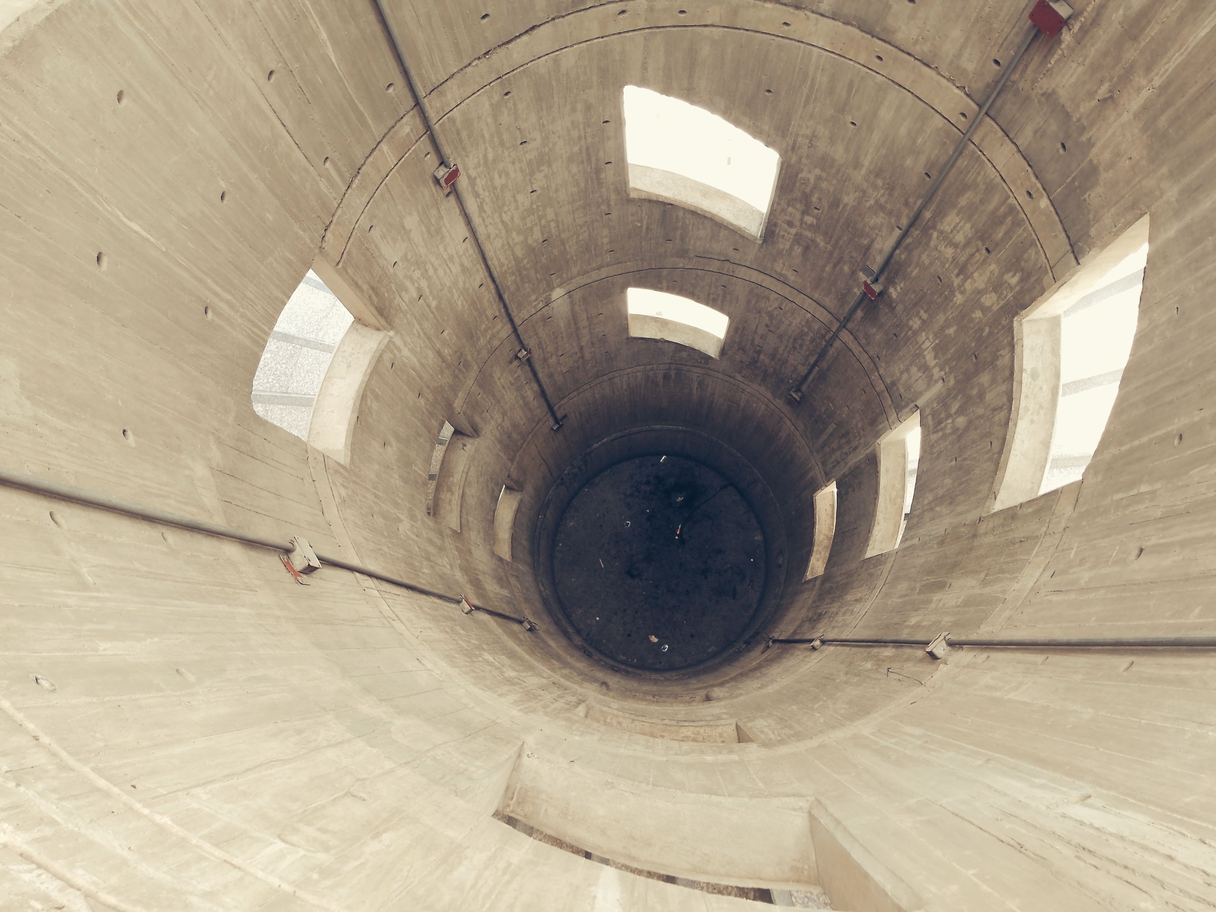 Industrial Concrete Silo Interior View Downward · Free Stock Photo