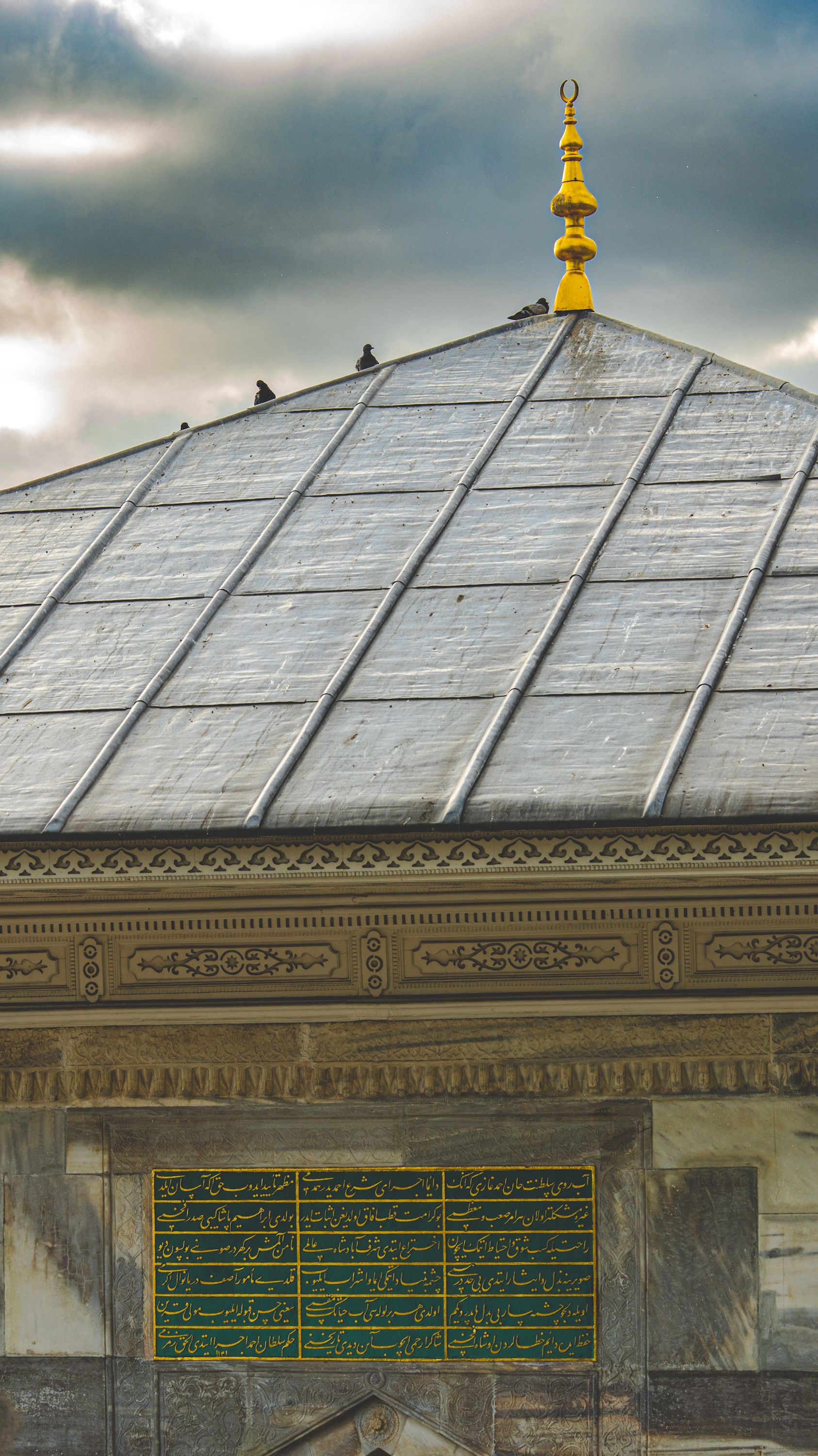 Ornate Roof with Arabic Calligraphy Detail · Free Stock Photo