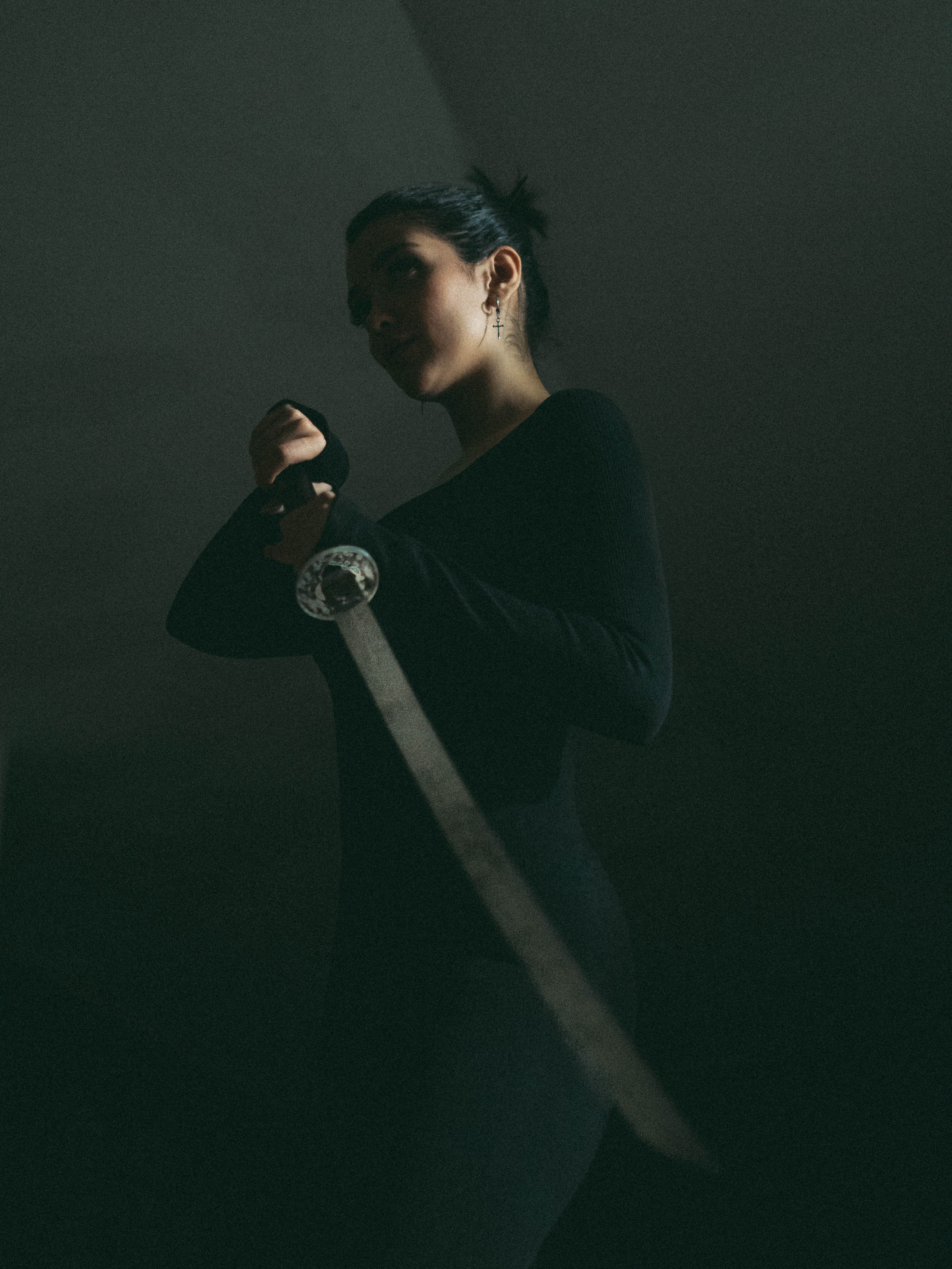 Mysterious Woman in Dark With Sword · Free Stock Photo
