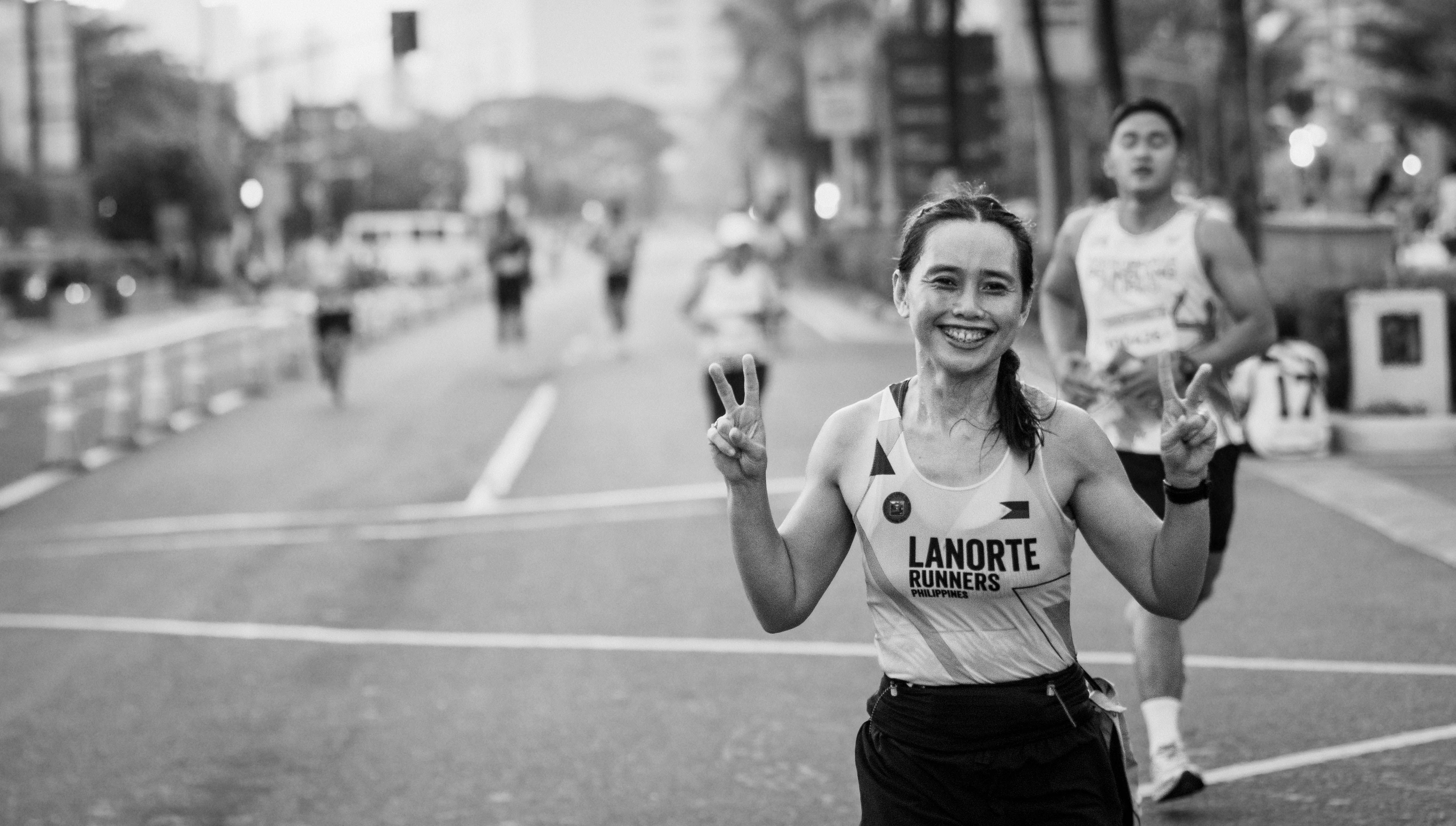 Marathon Runner Celebrating in Pasay City · Free Stock Photo