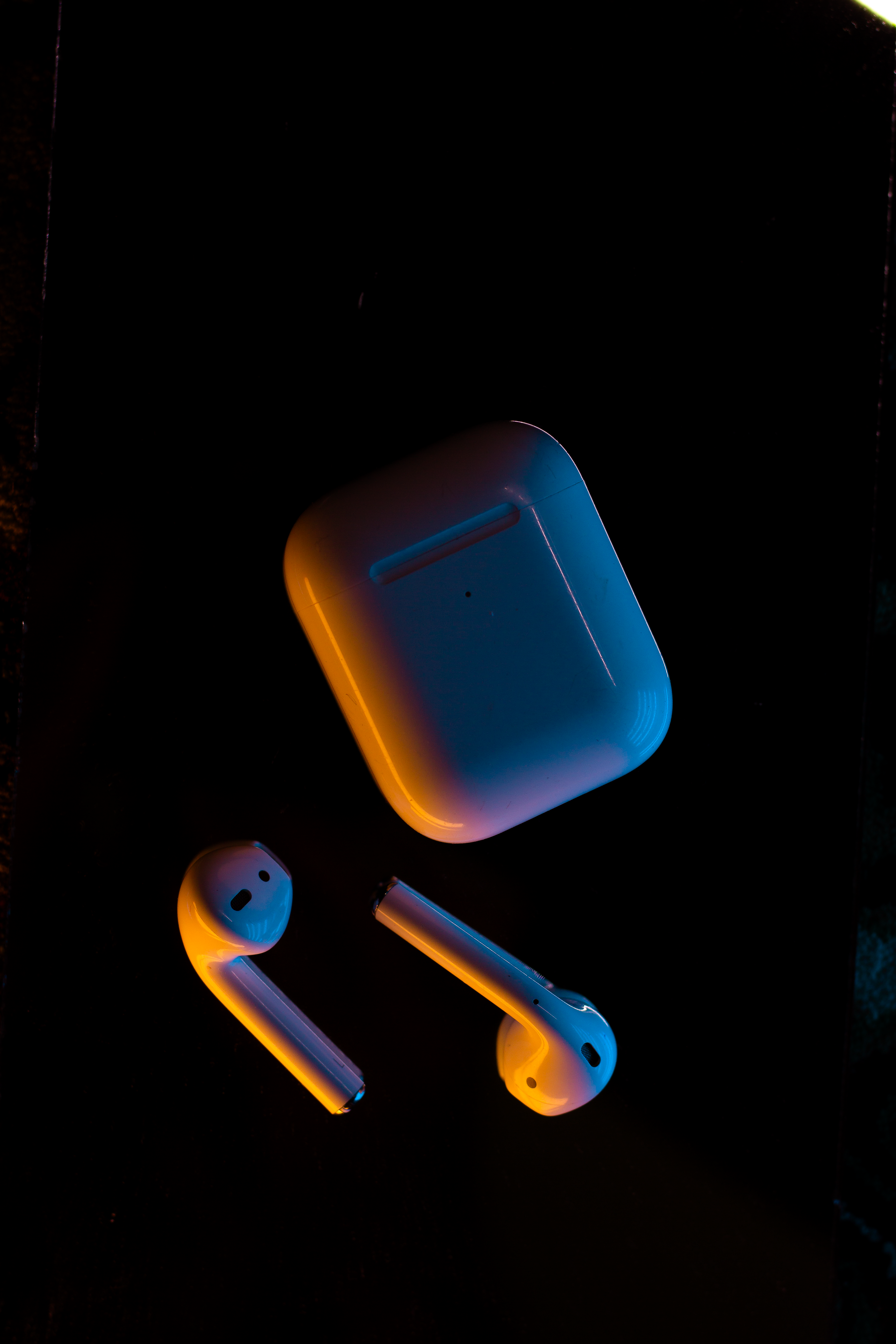 Wireless Earbuds with Warm Glow Background · Free Stock Photo
