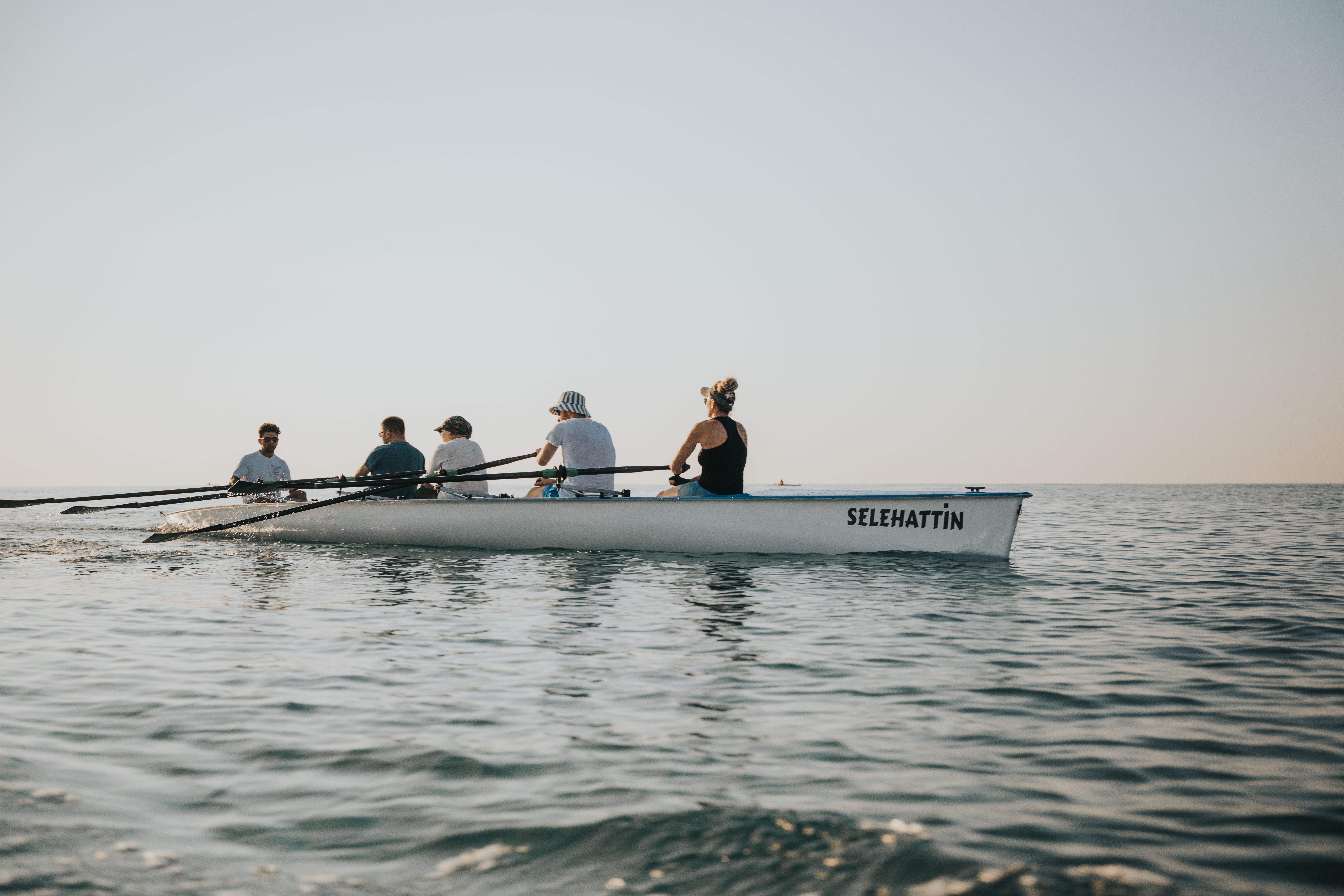 Team Rowing Across Calm Waters in Antalya · Free Stock Photo
