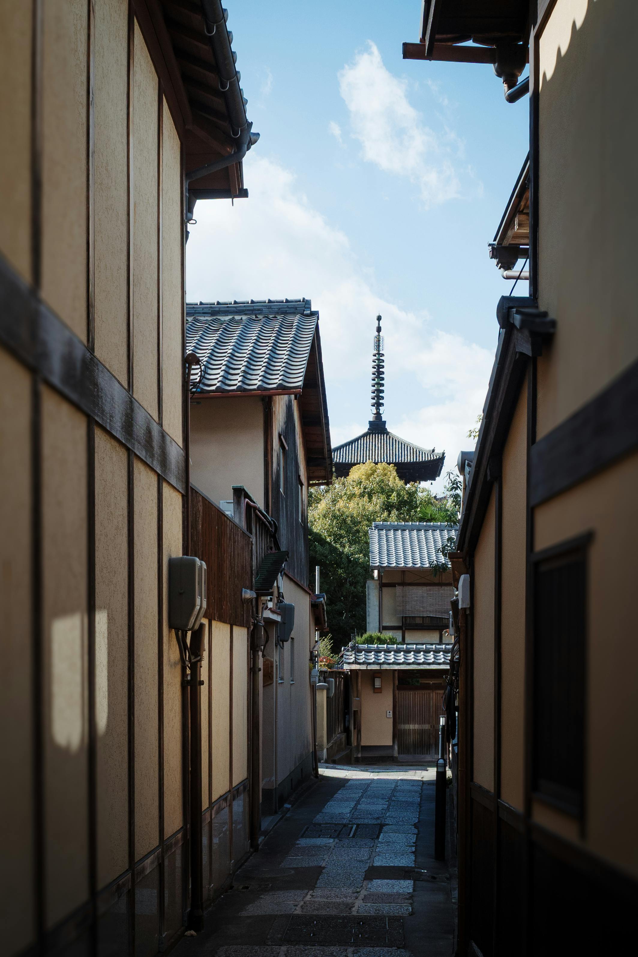 Traditional Japanese Alley with Pagoda View · Free Stock Photo