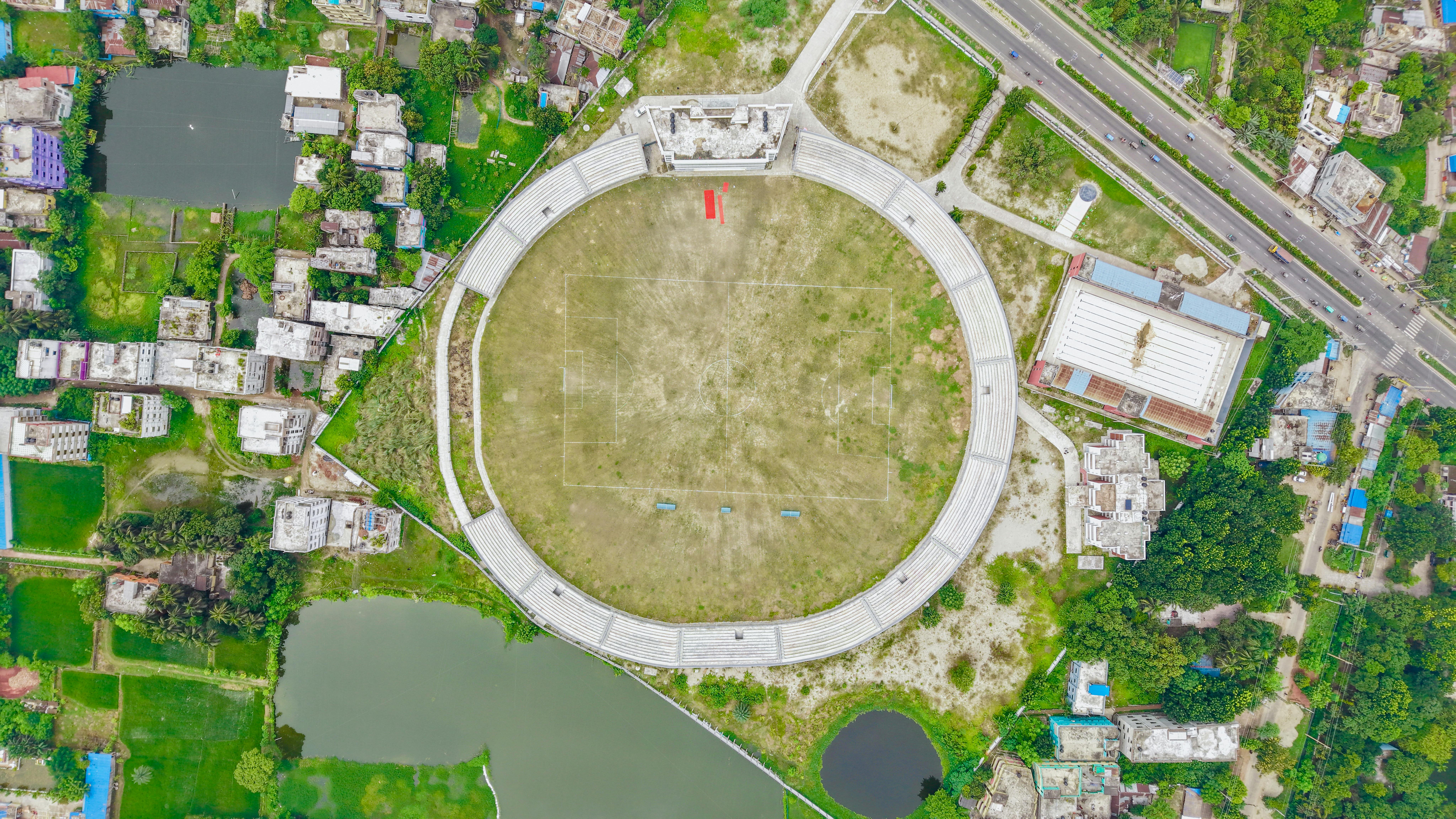 Aerial View of Large Circular Stadium in Urban Setting · Free Stock Photo