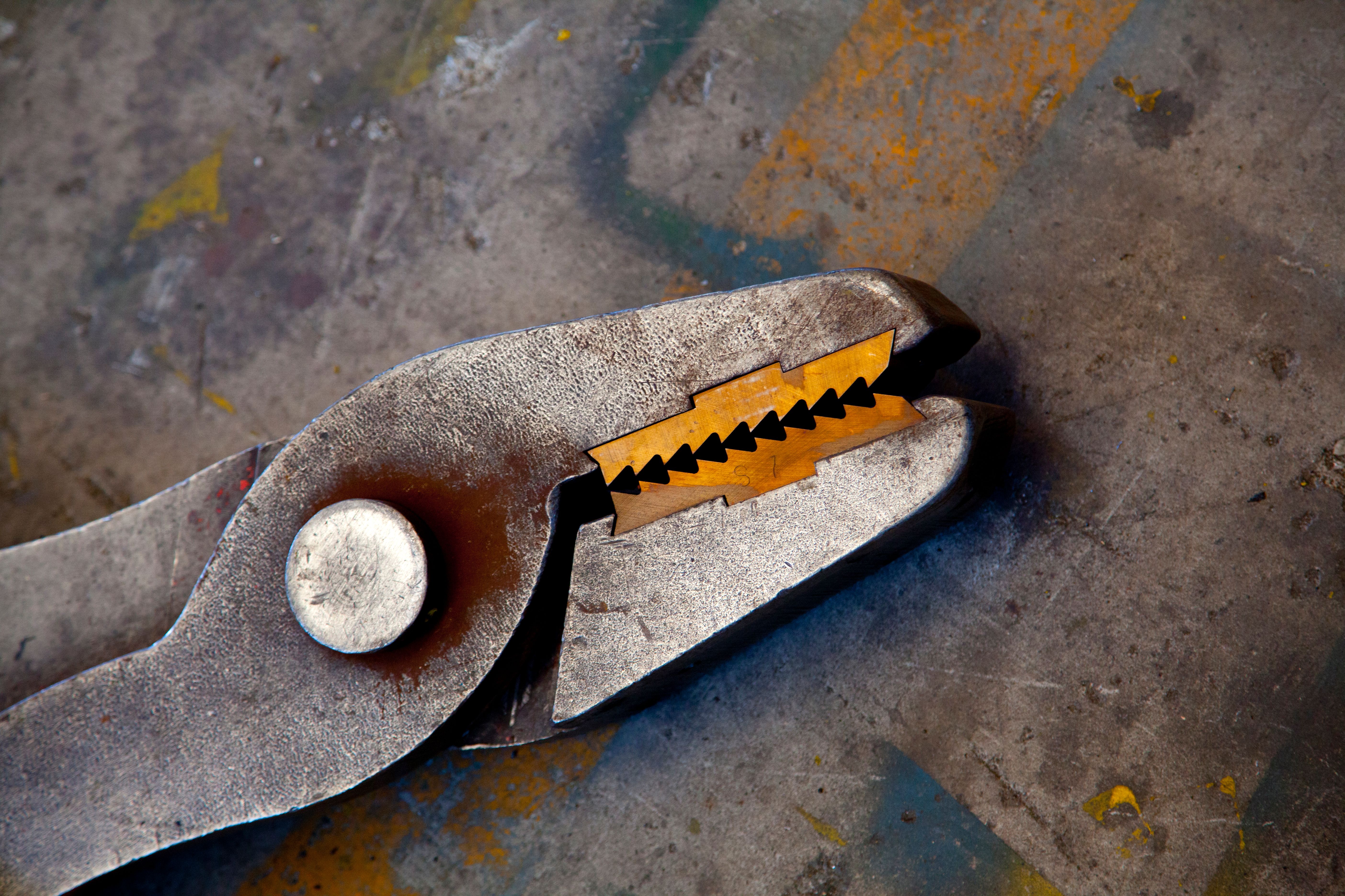 Close-Up of Industrial Pliers on Rusty Surface · Free Stock Photo