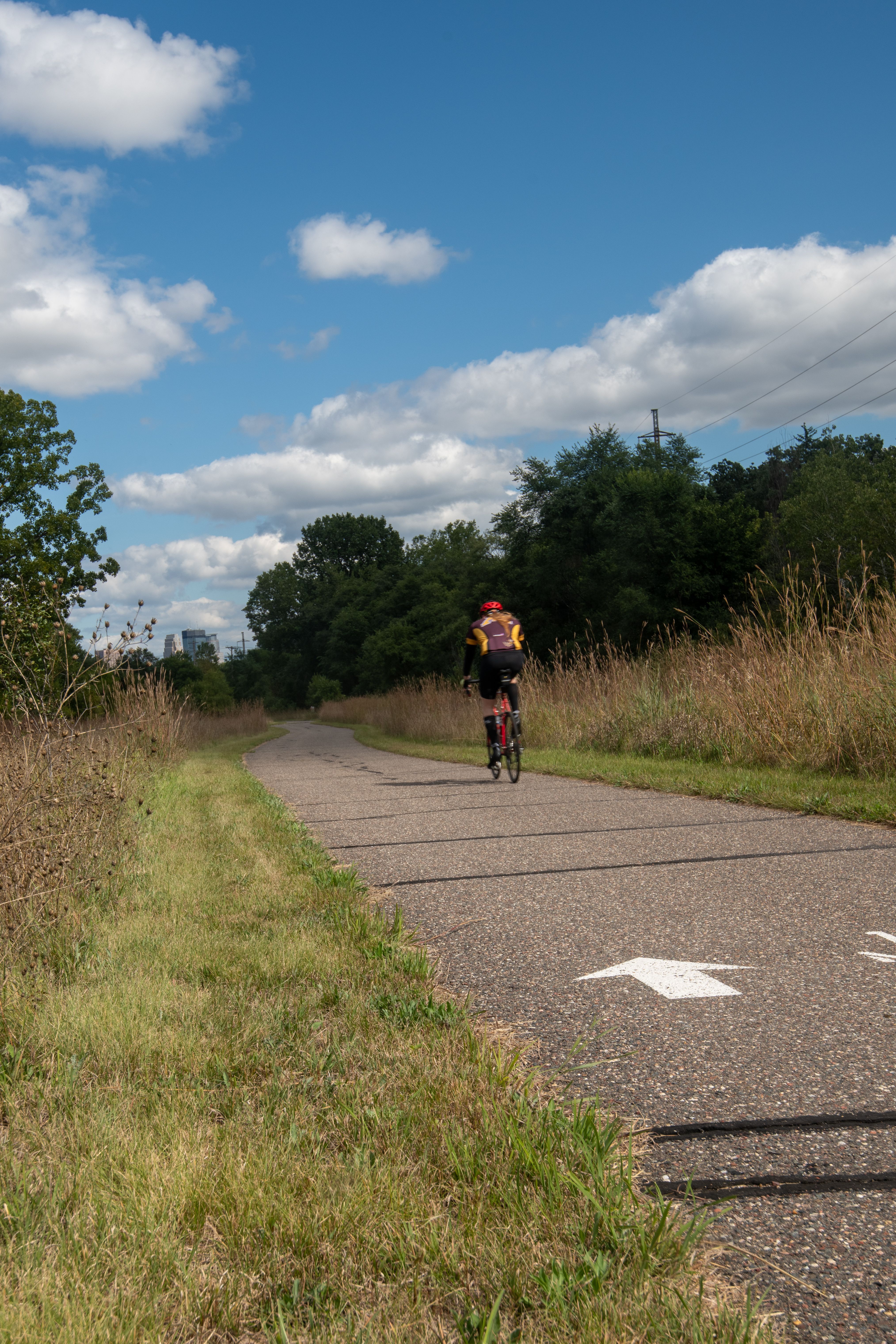 Cyclist on a Sunny Trail in Minneapolis · Free Stock Photo