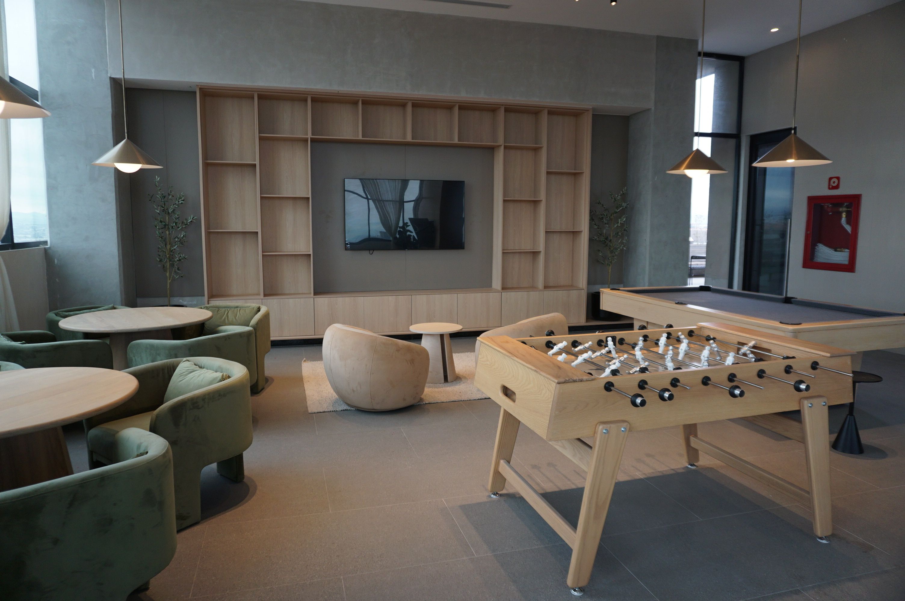 Modern Recreational Lounge with Game Tables · Free Stock Photo