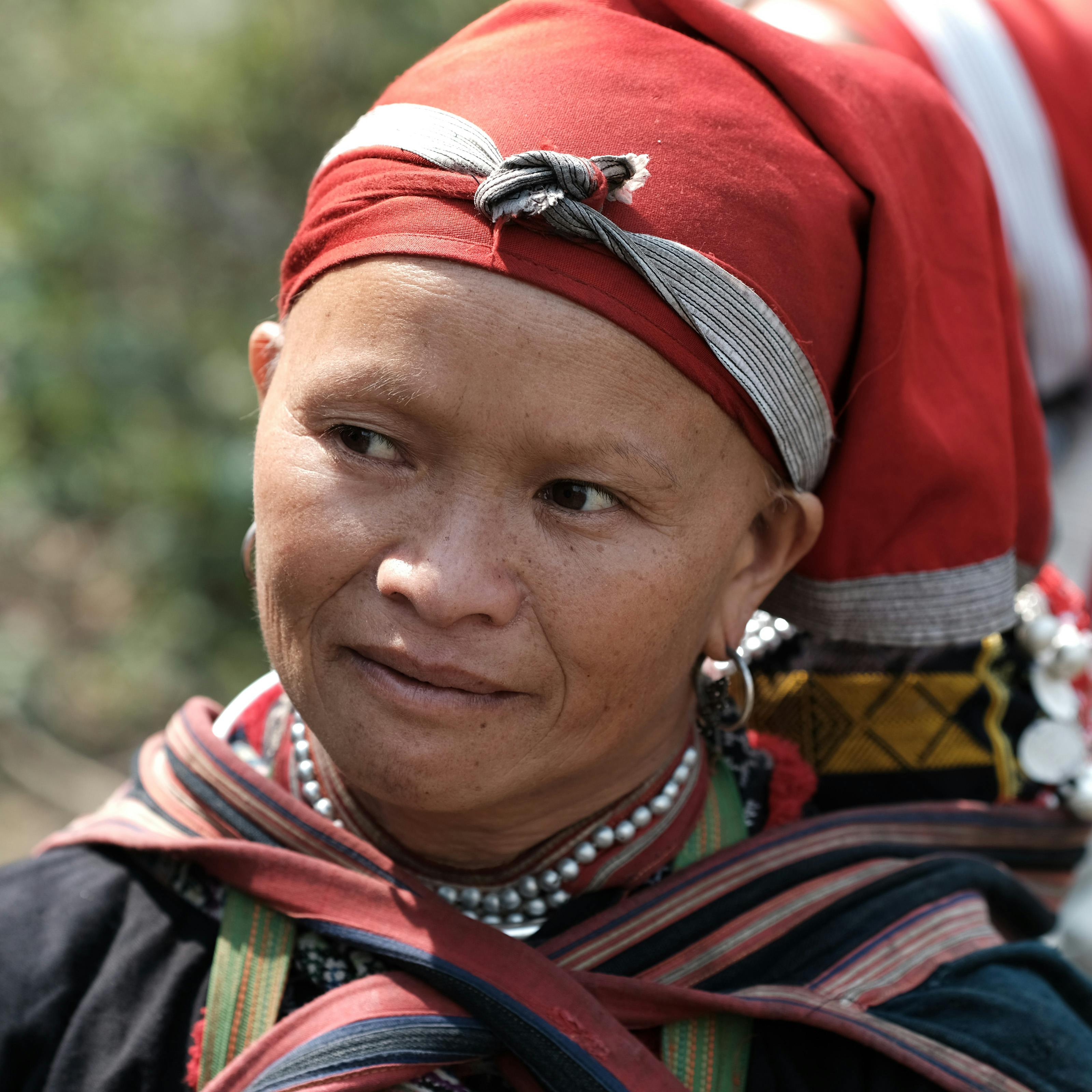 Portrait of a Woman in Traditional Red Dao Attire · Free Stock Photo