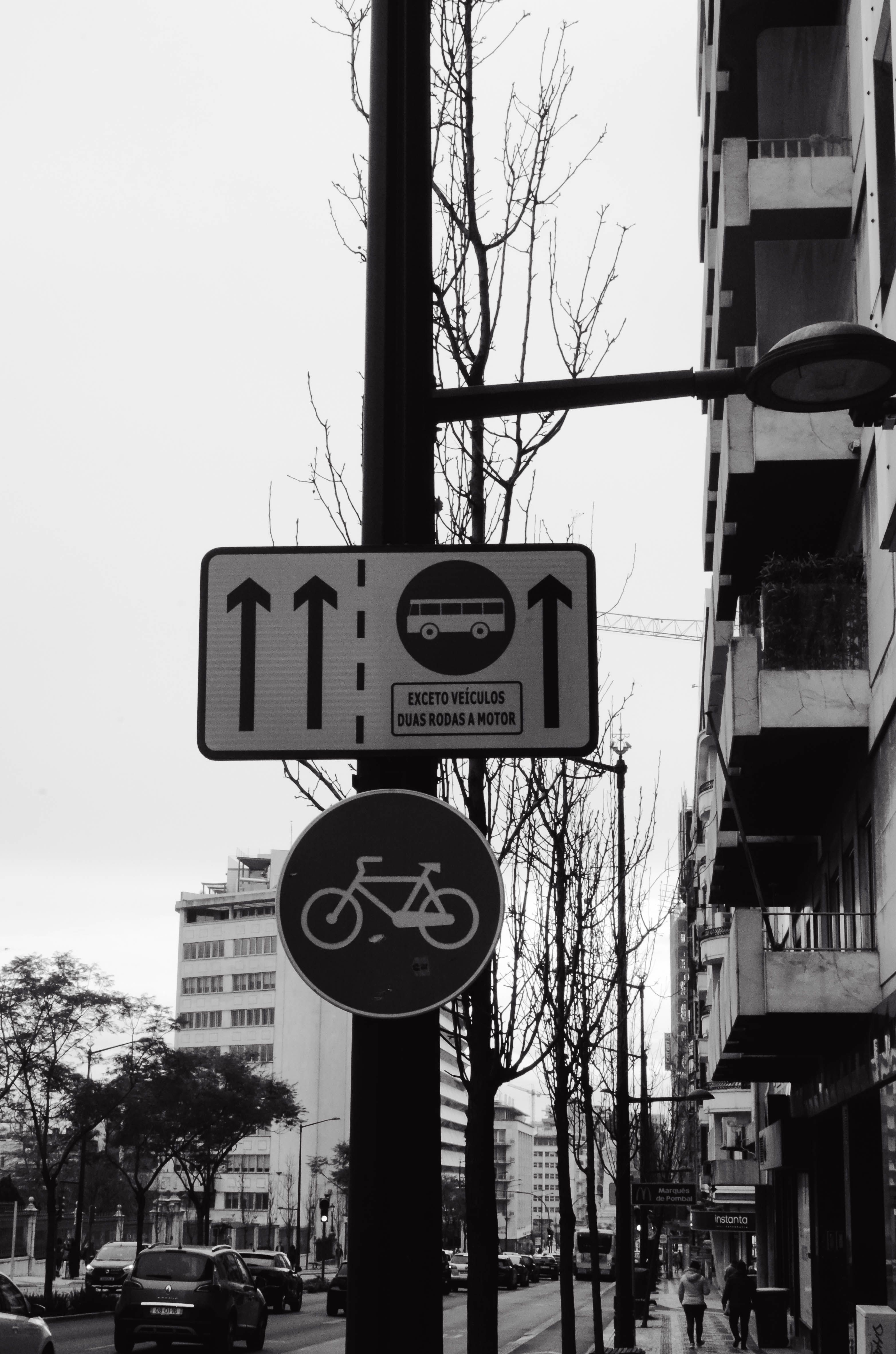 Black and White Urban Street with Traffic Sign · Free Stock Photo