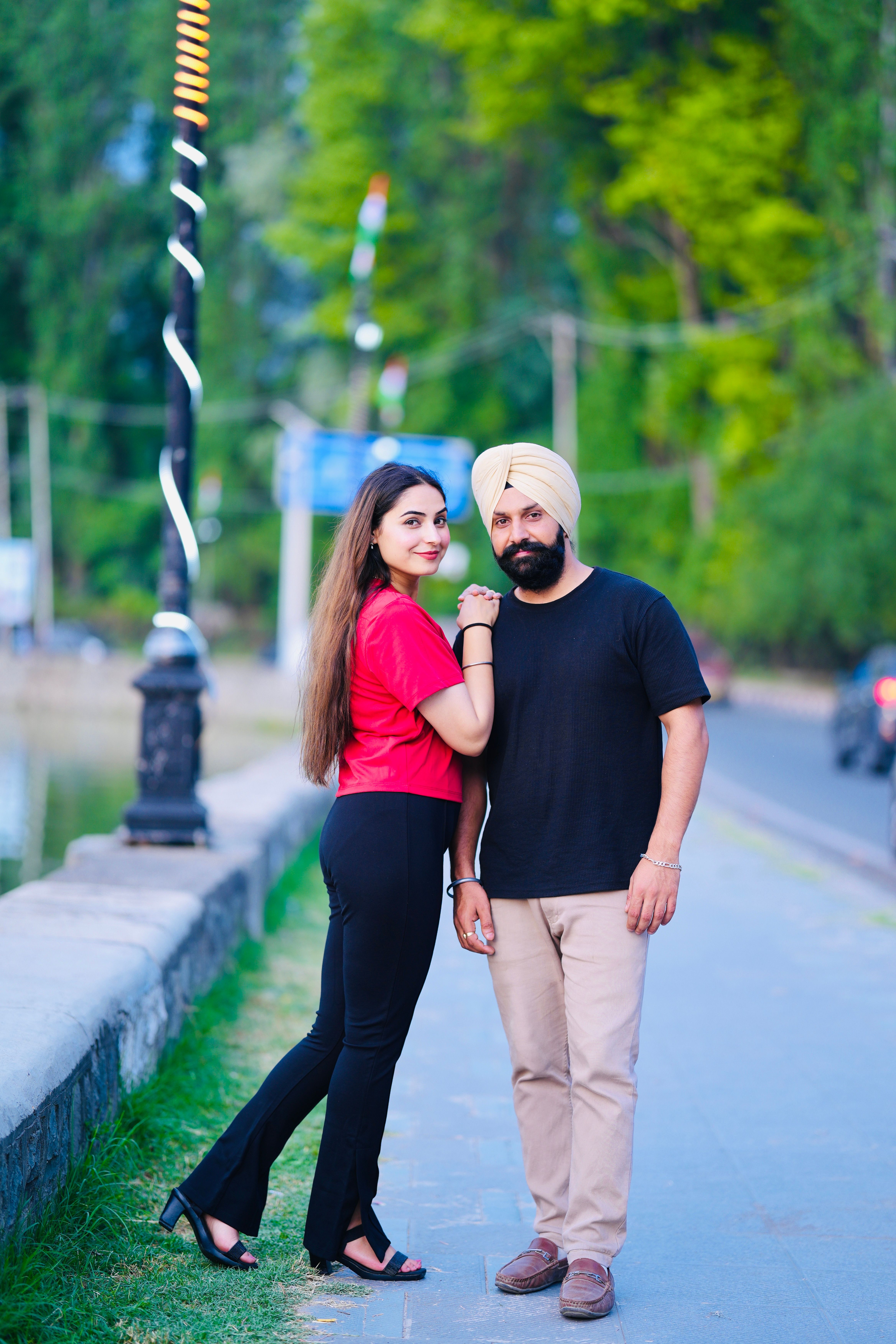 Happy Couple Strolling by Dal Lake in Srinagar · Free Stock Photo