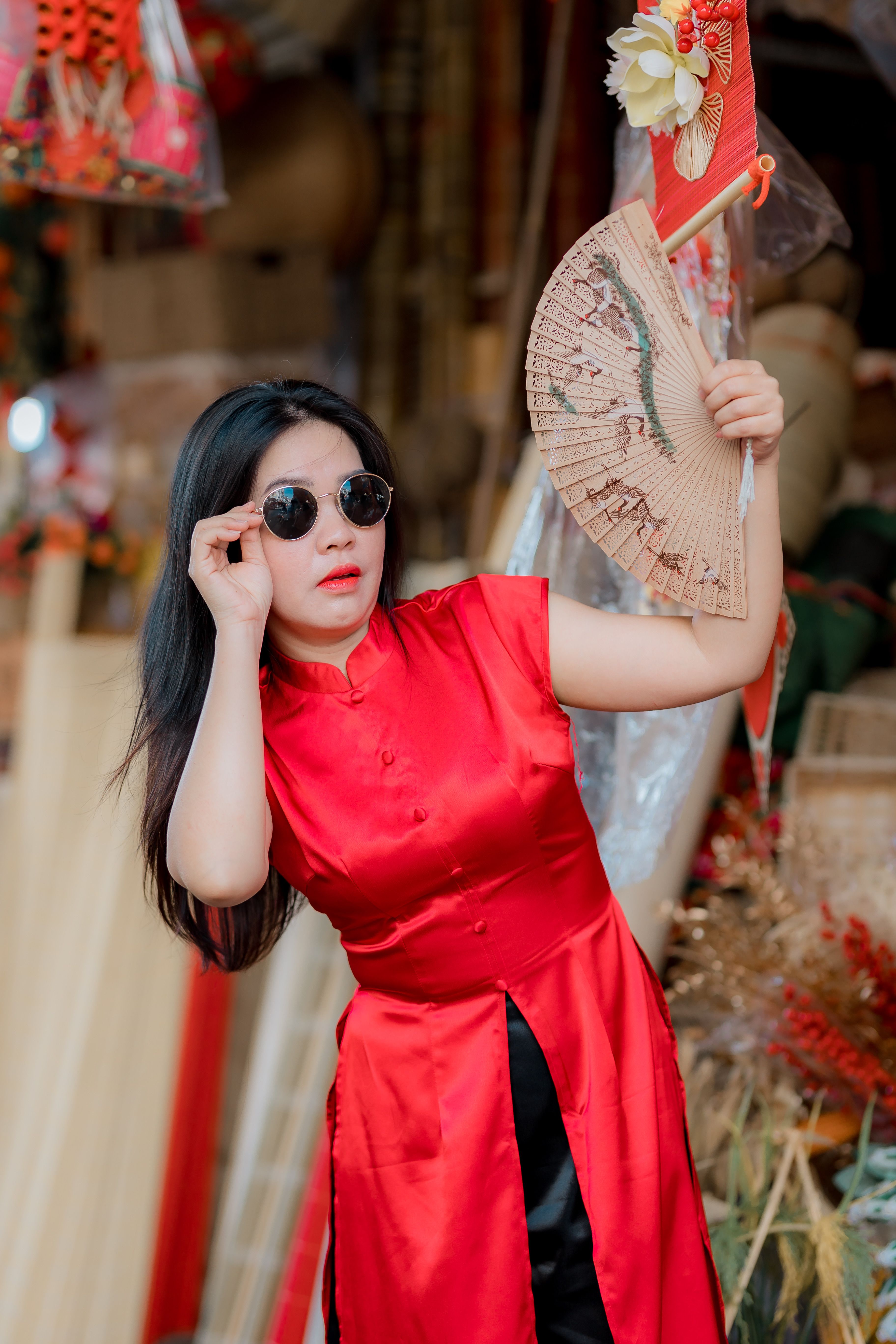 Woman in Red Cheongsam with Sunglasses and Fan · Free Stock Photo