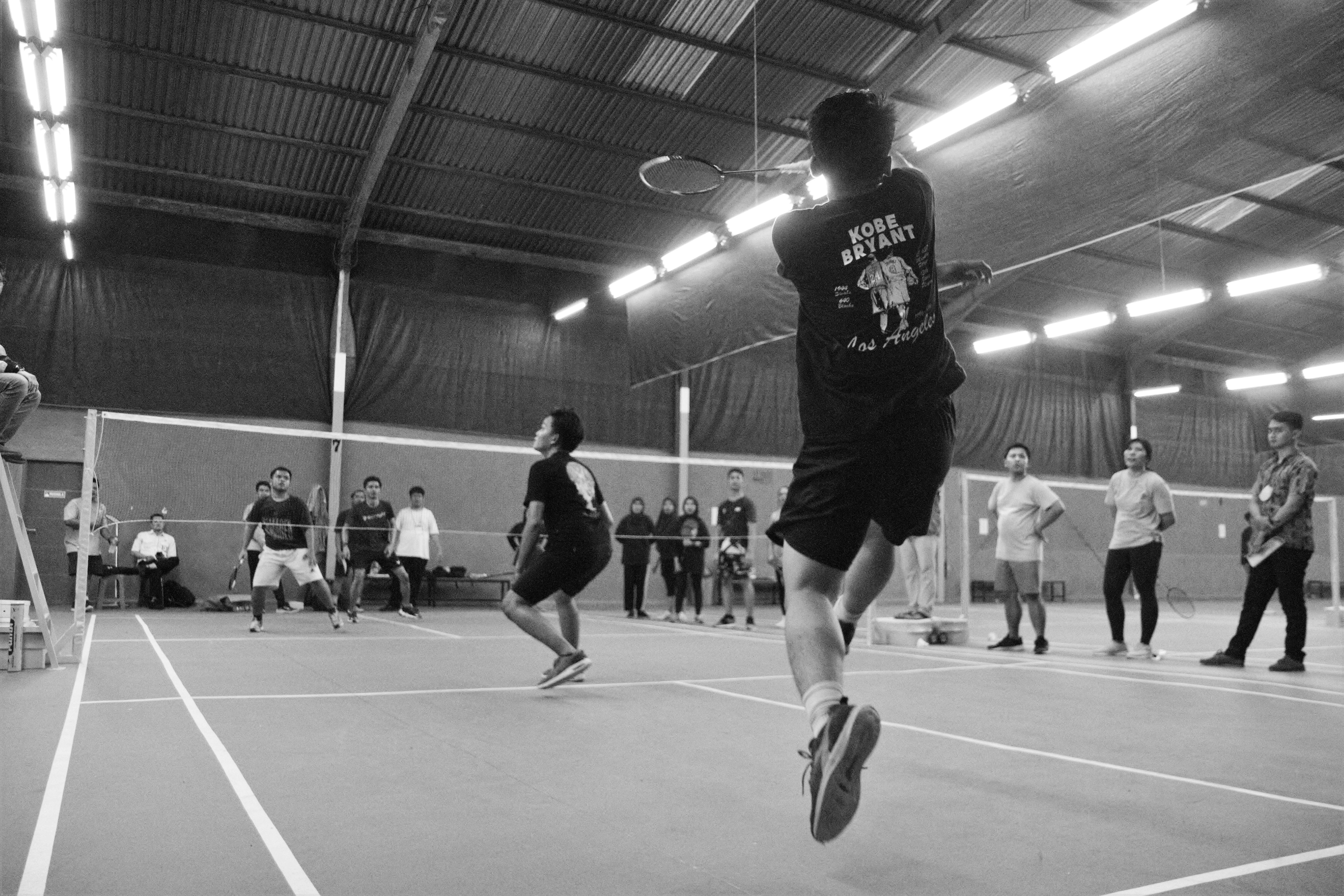 Indoor Badminton Match Action Shot · Free Stock Photo