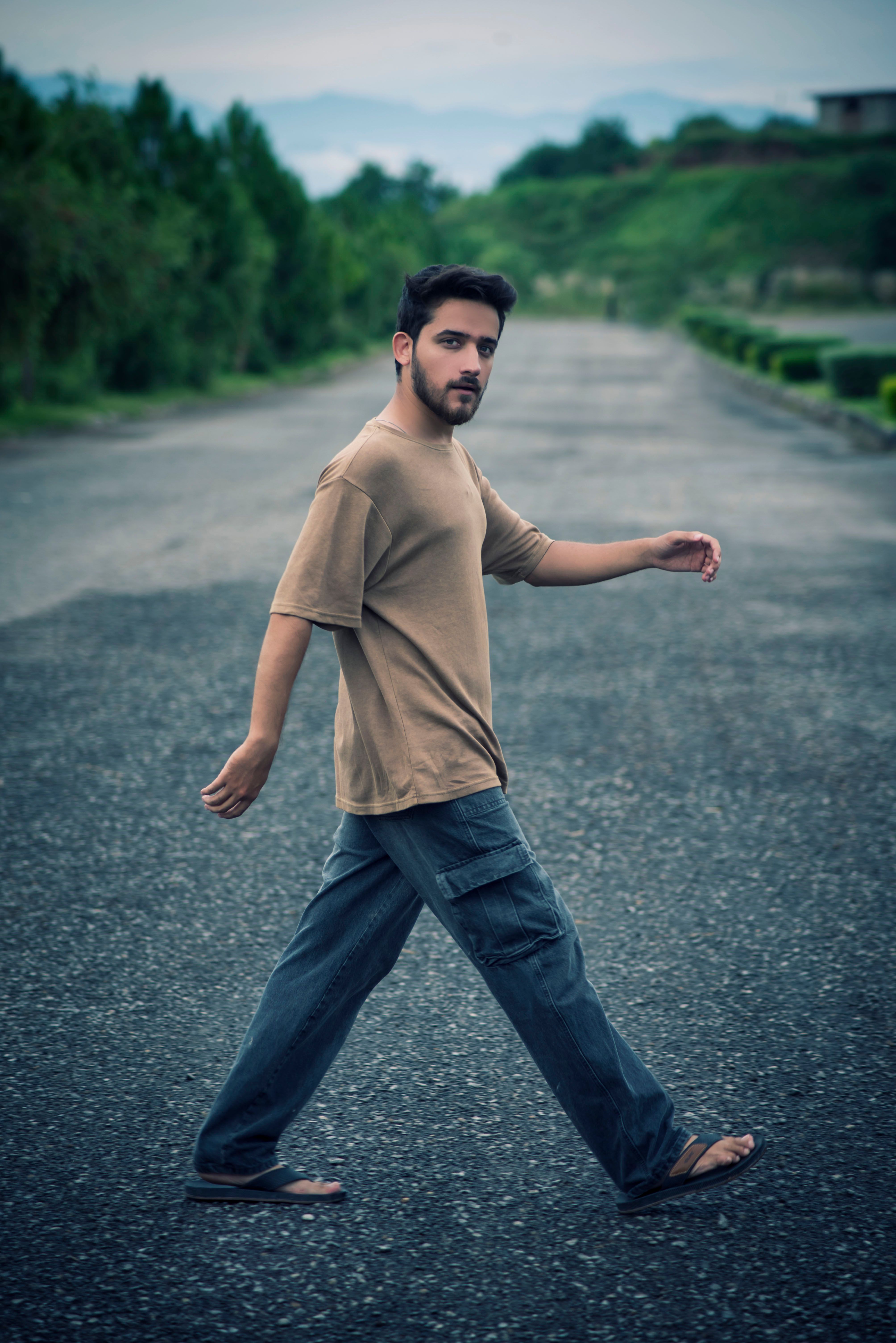Stylish Male Model Walking Outdoors · Free Stock Photo