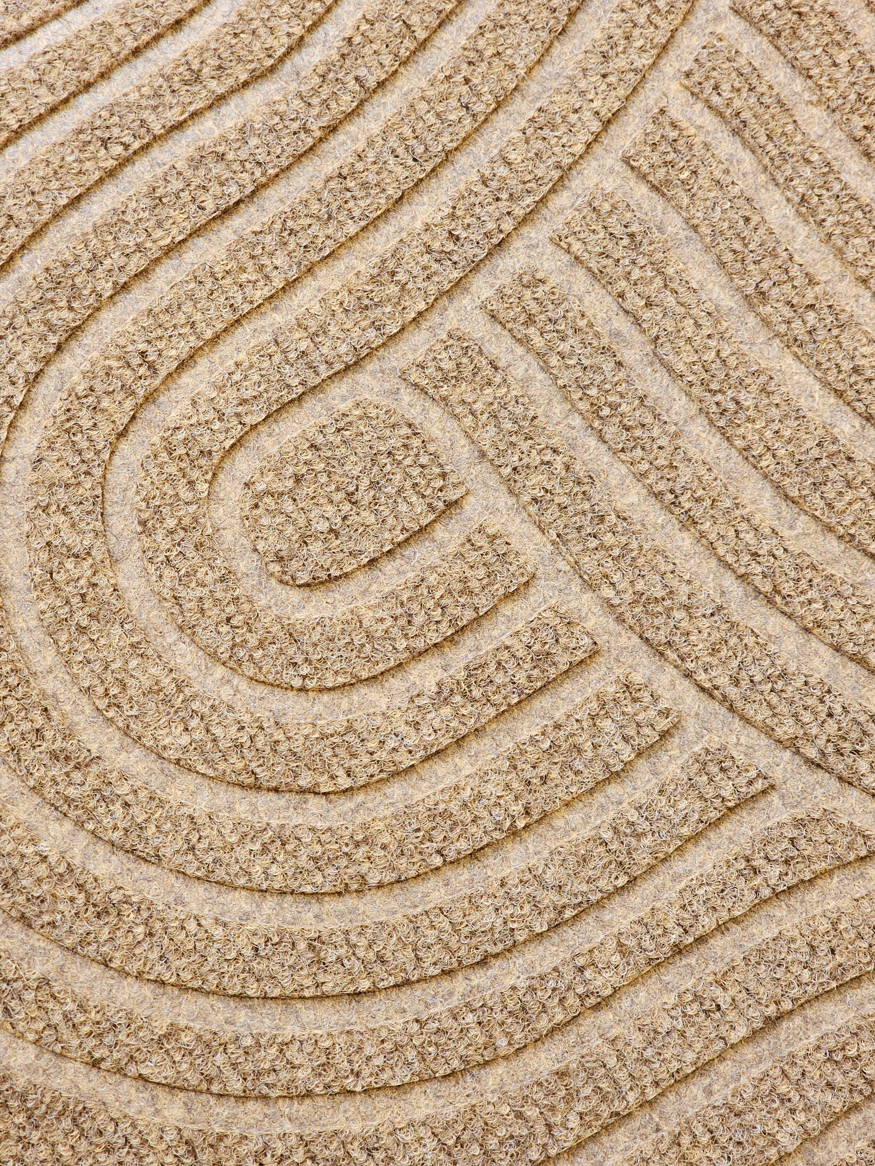 Abstract Beige Textured Carpet Design · Free Stock Photo