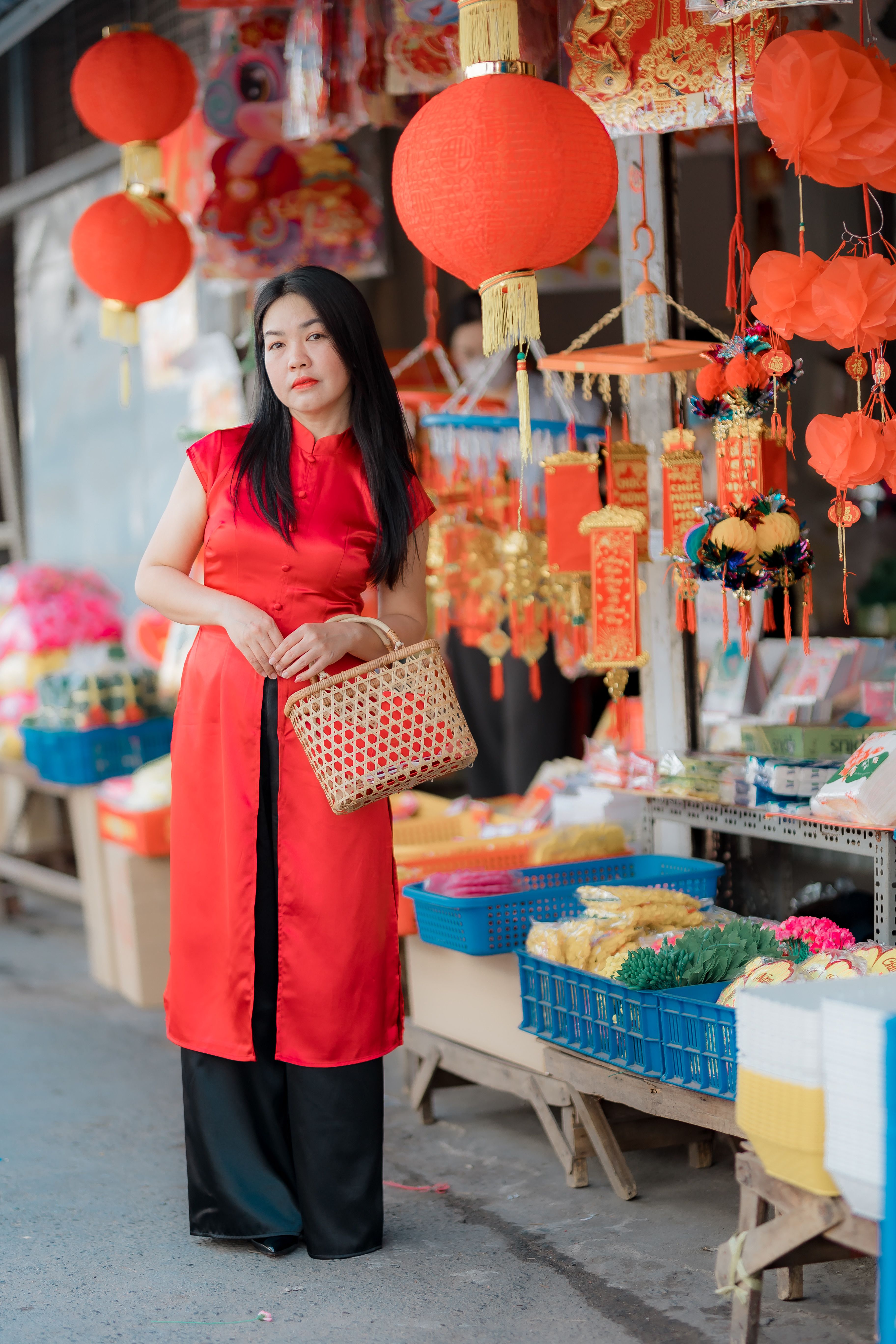 Woman in Traditional Red Dress at Festive Street Market · Free Stock Photo