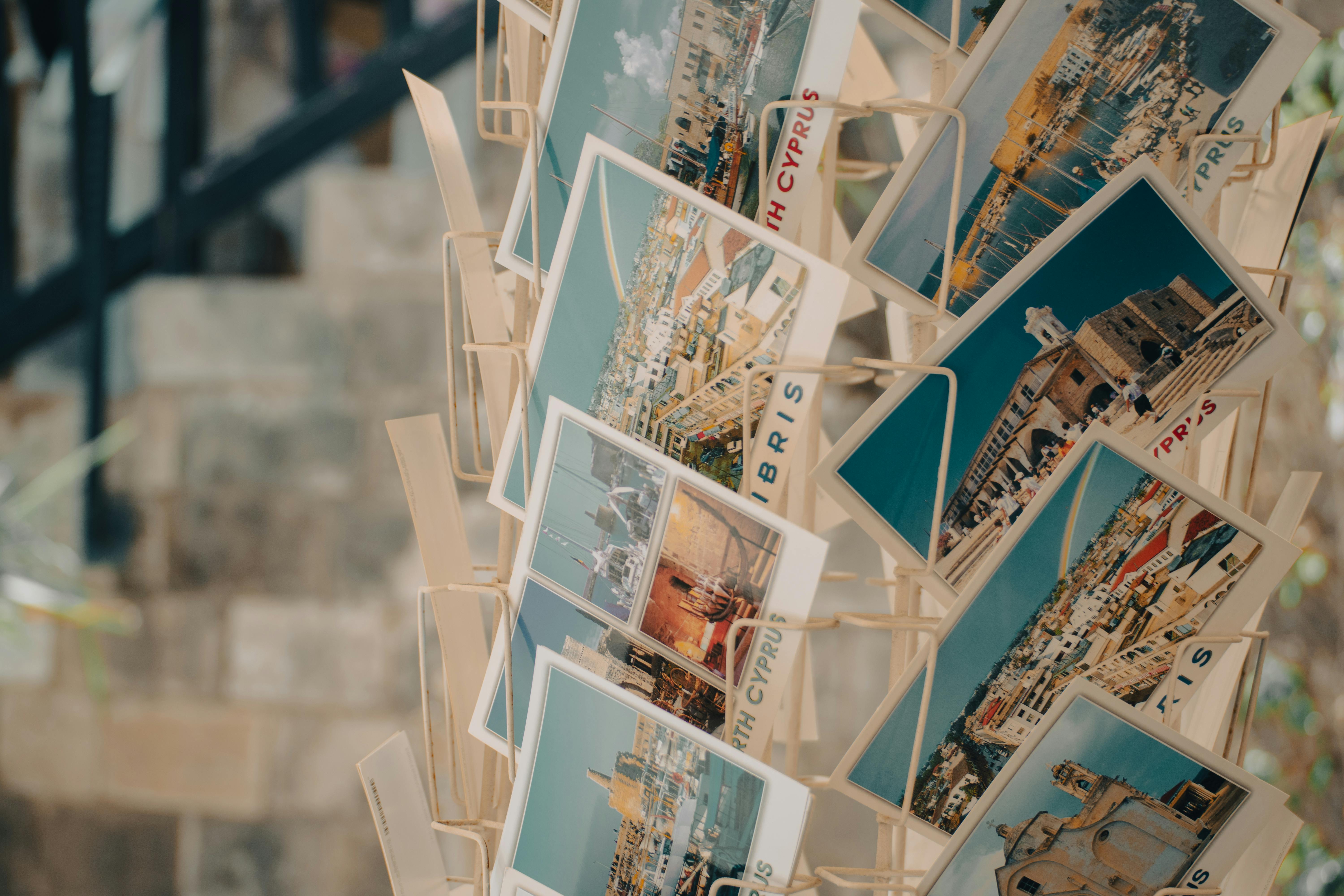 Colorful Cyprus Postcards in Display Rack · Free Stock Photo